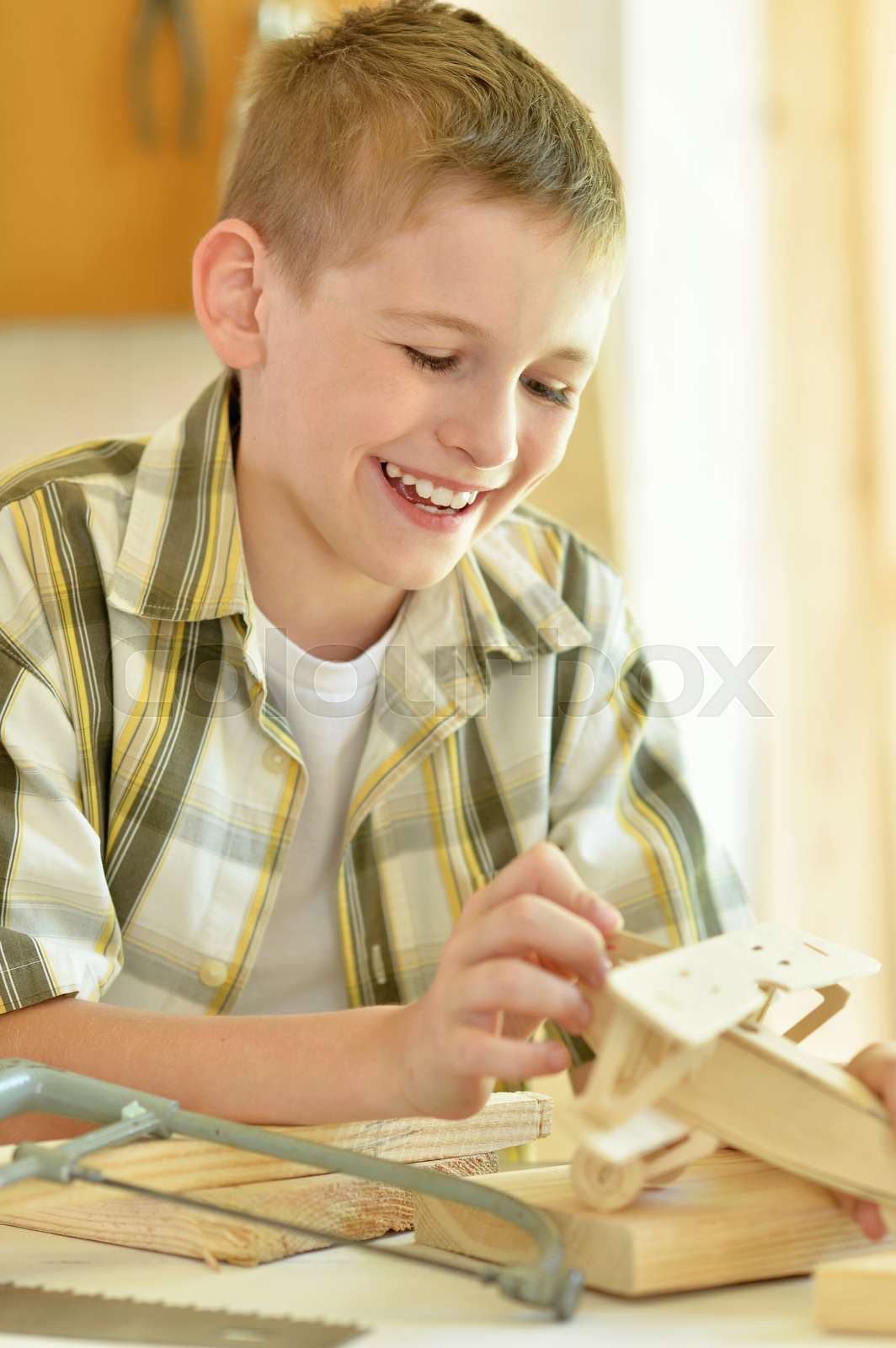 little boy working with wood | Stock image | Colourbox
