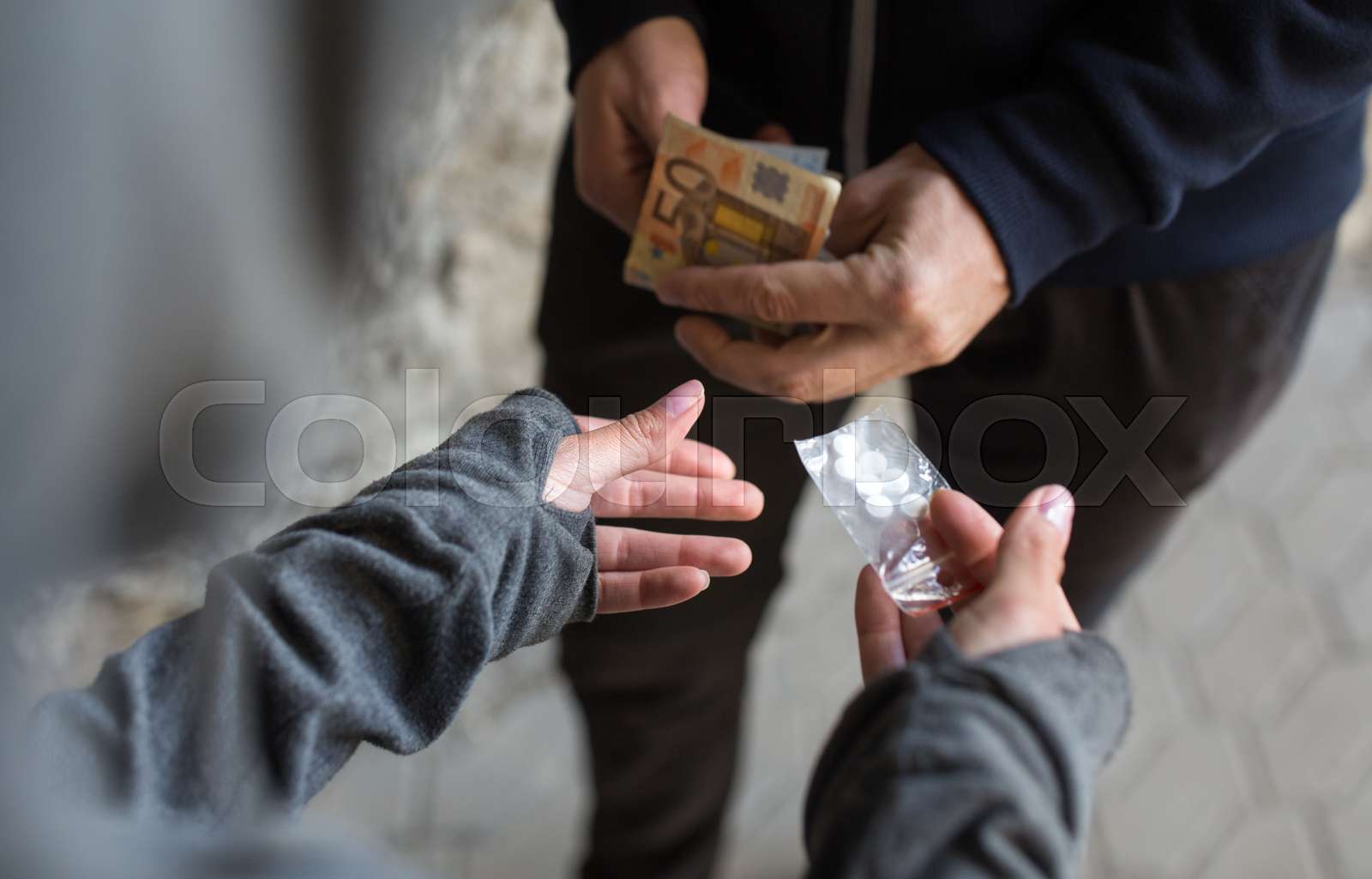 close up of addict buying dose from drug dealer | Stock image | Colourbox