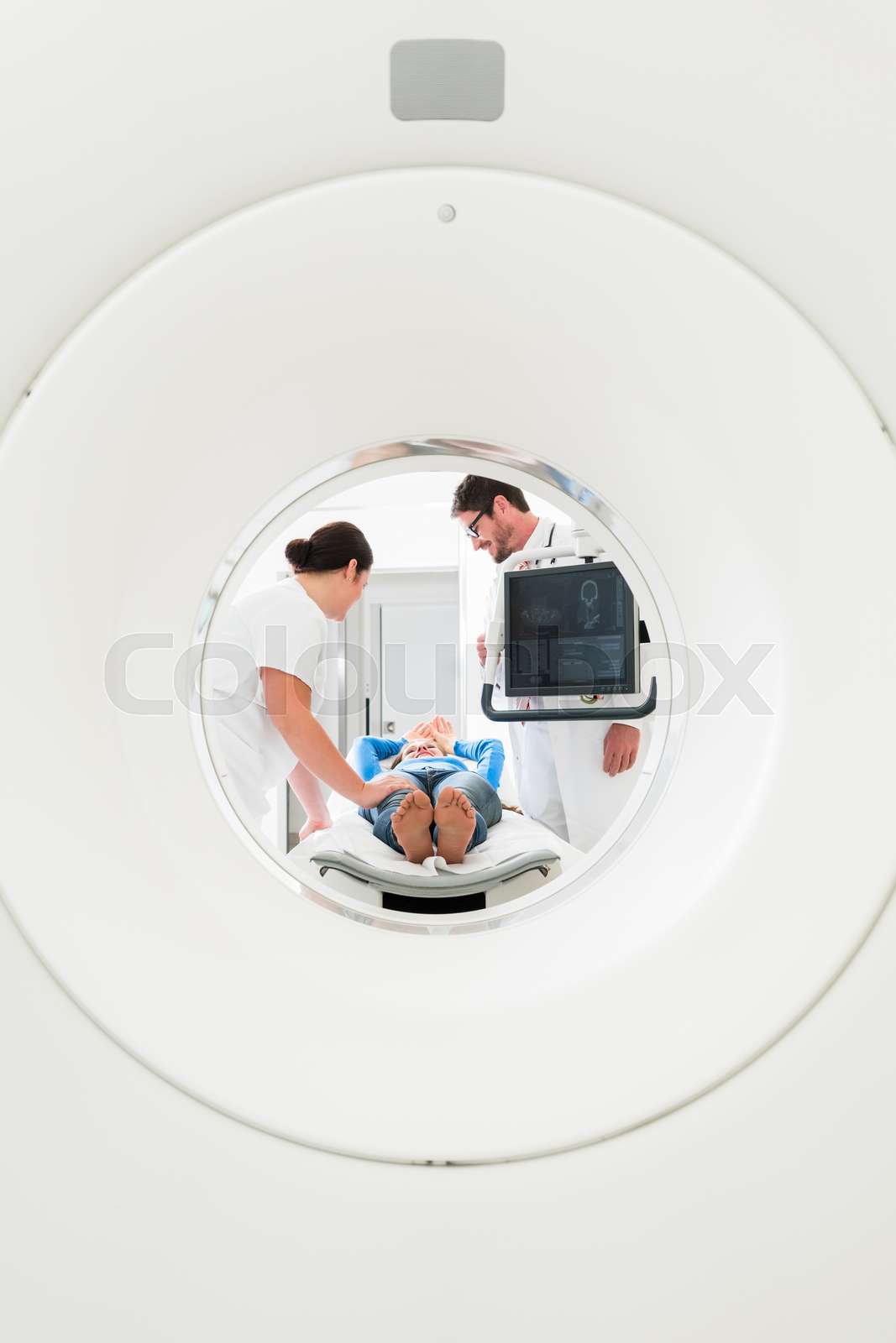 Doctor, nurse, and patient at CT scan | Stock image | Colourbox