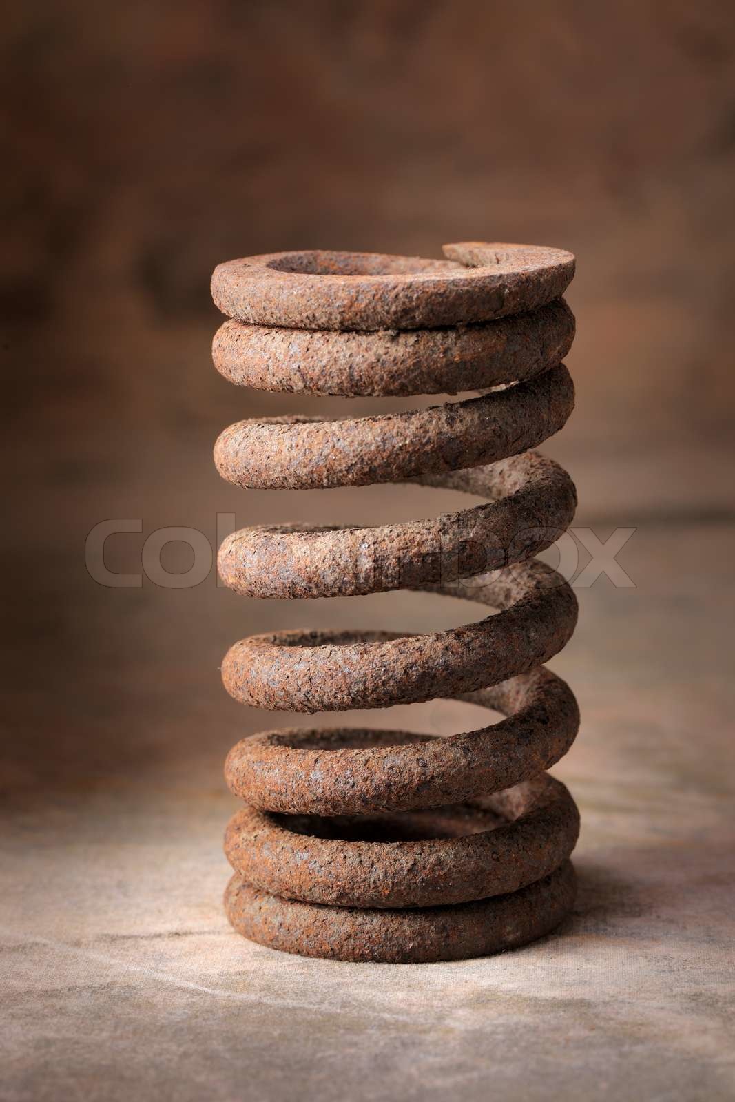 Old rusty and dirty coil spring | Stock image | Colourbox