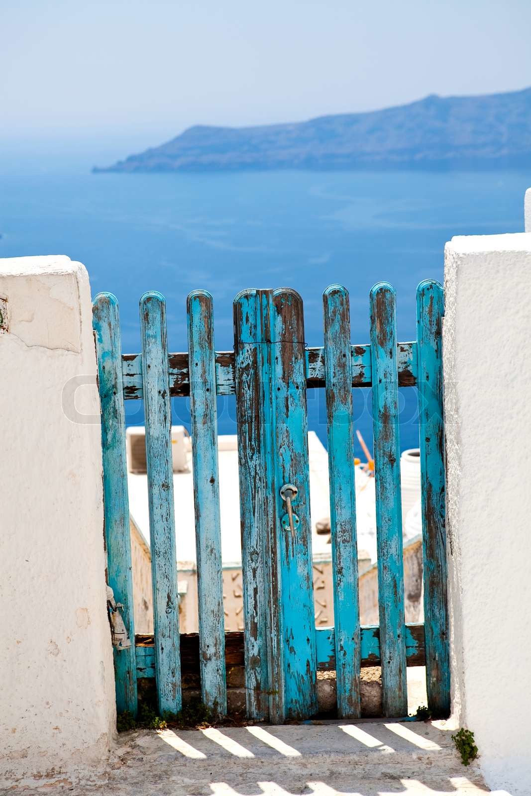 Old turquoise colored wooden gate in Thira, Santorini, Greece | Stock ...