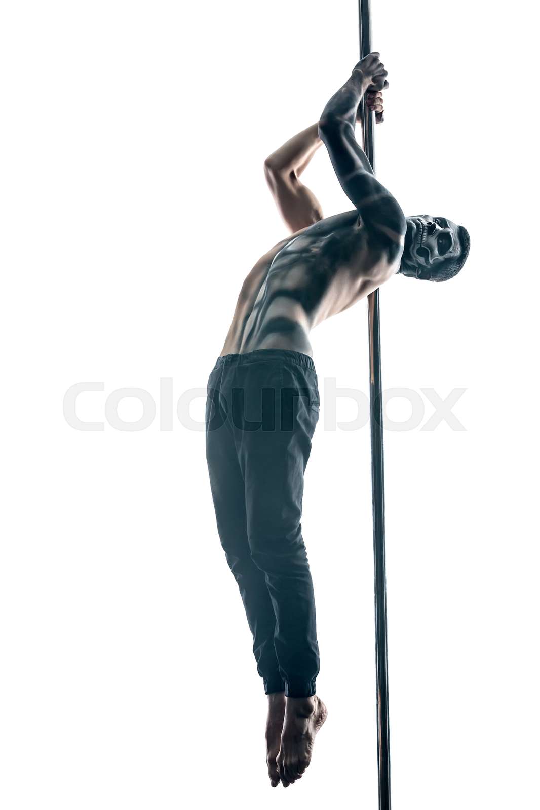 Male pole dancer with body-art on pylon | Stock image | Colourbox