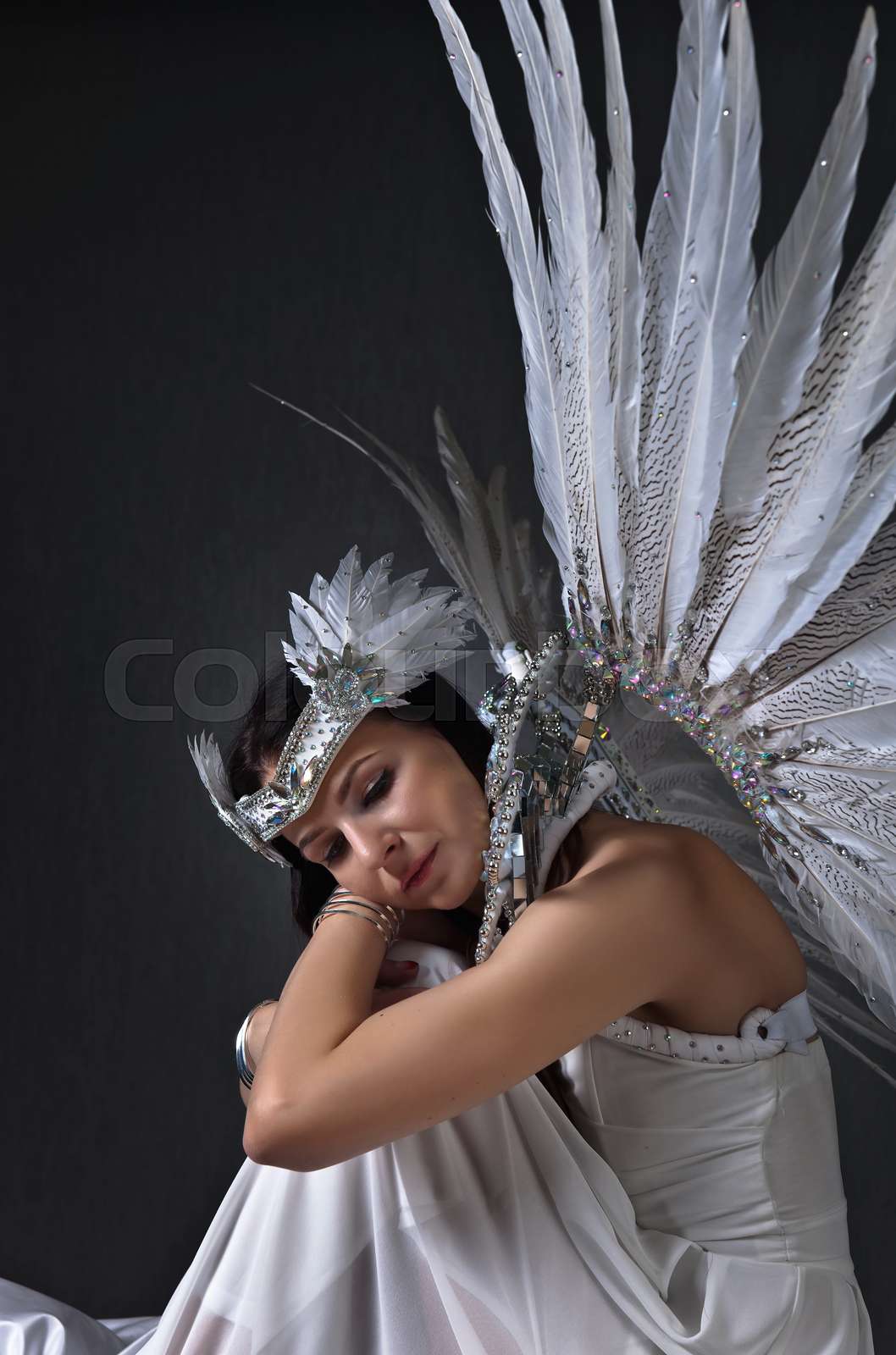 Beautiful woman in white dress with angel wings | Stock image | Colourbox