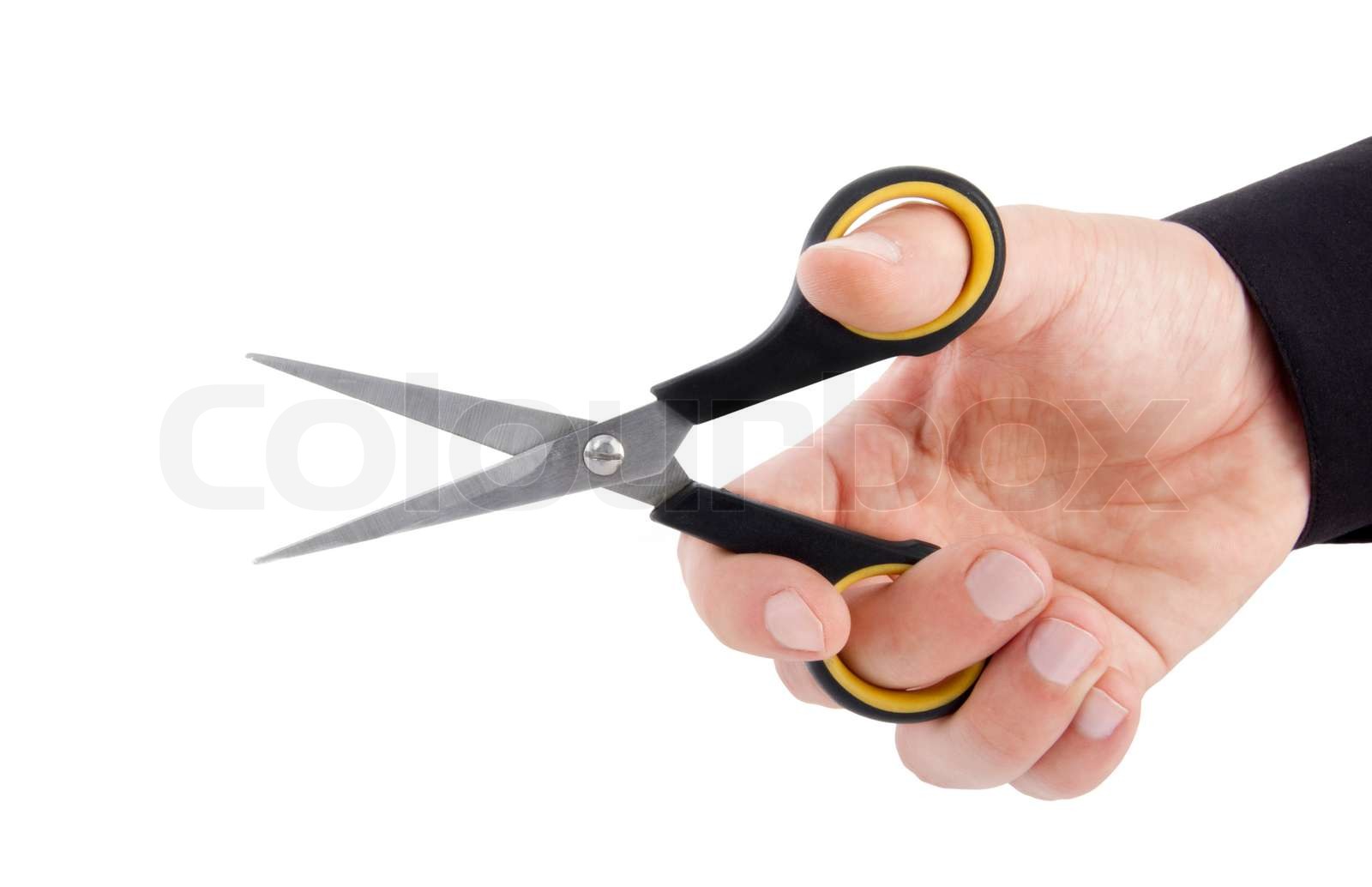 Schere in der Hand isoliert auf weißem Hintergrund | Stock Bild | Colourbox