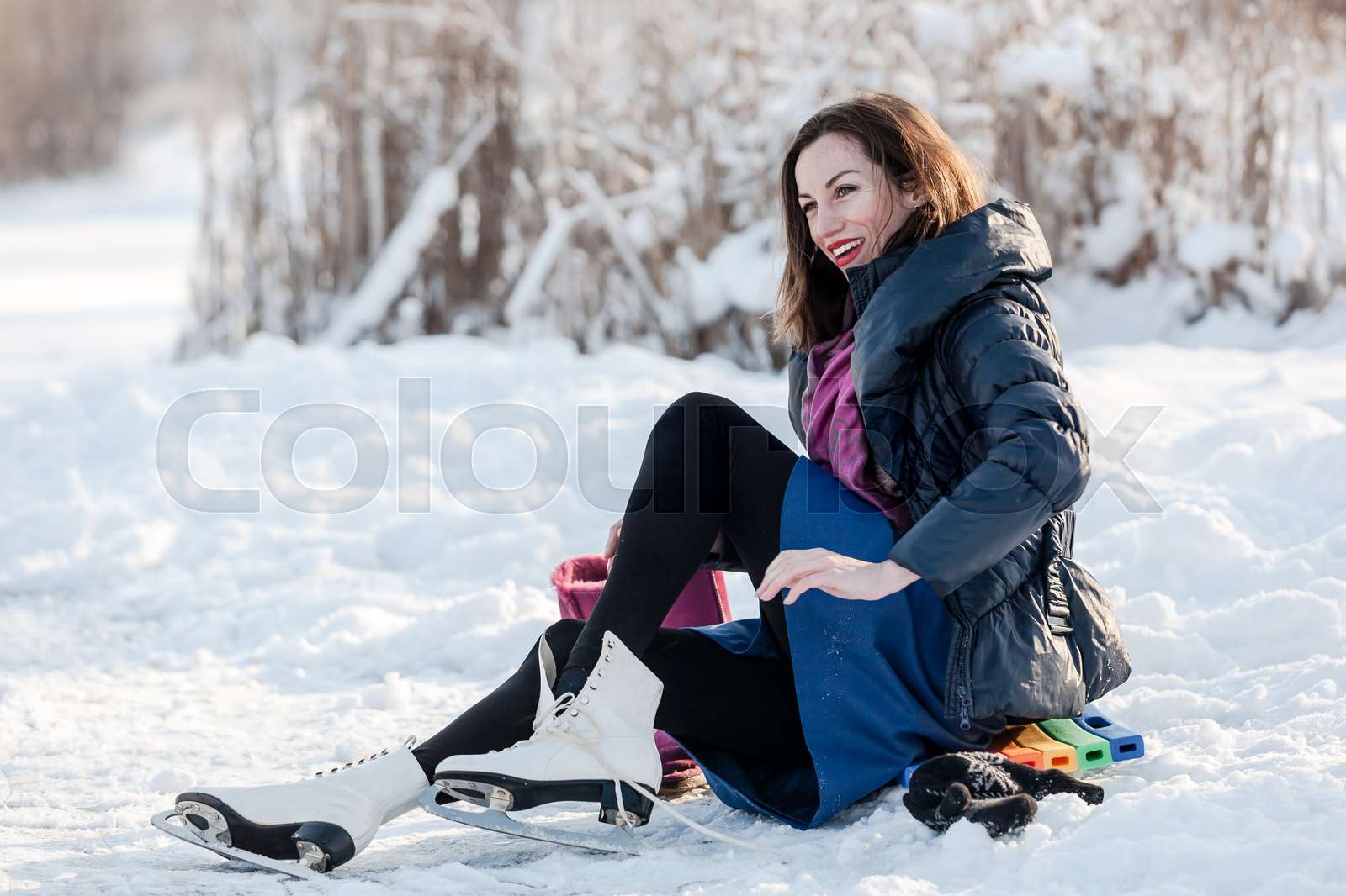 Happy girl wearing ice skates | Stock image | Colourbox