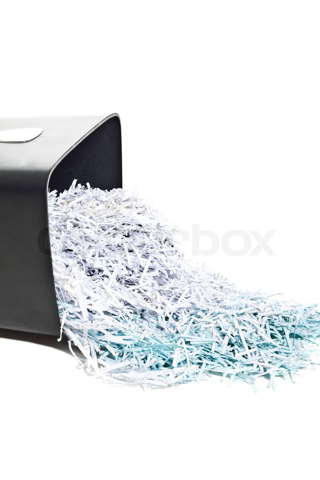 trash can overturned with shredded paper isolated | Stock image | Colourbox