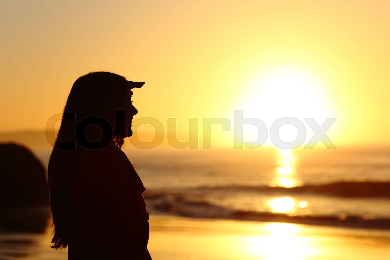 Woman silhouette looking forward at sunset | Stock image | Colourbox