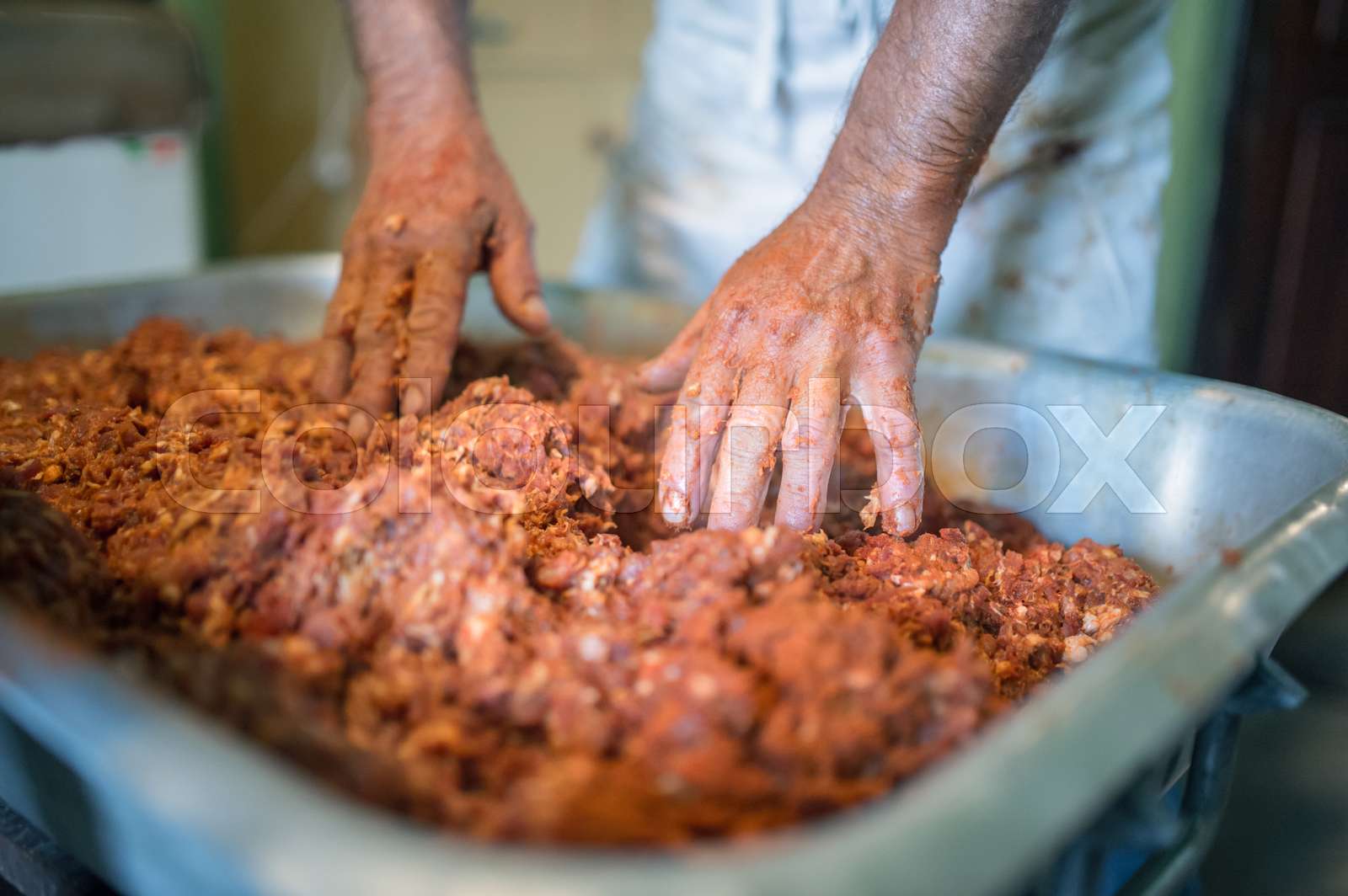 Man making sausages the traditional way using sausage filler. | Stock ...