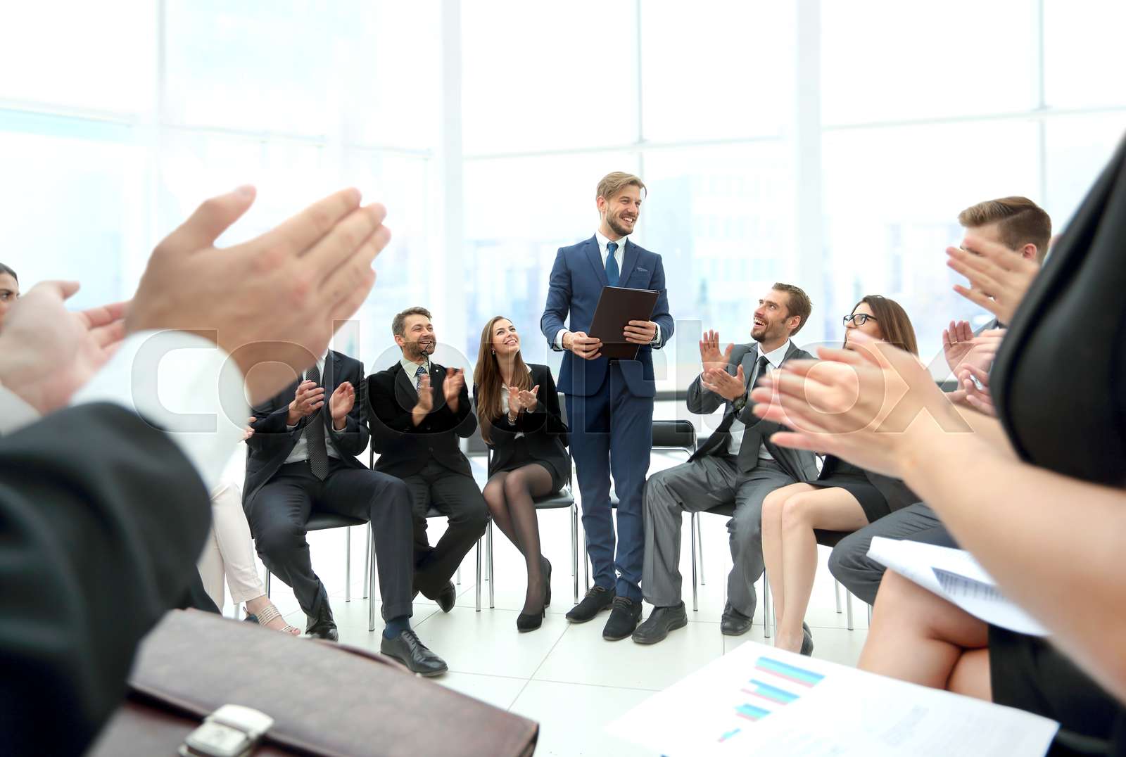 Business group greets leader with clapping and smiling | Stock image ...