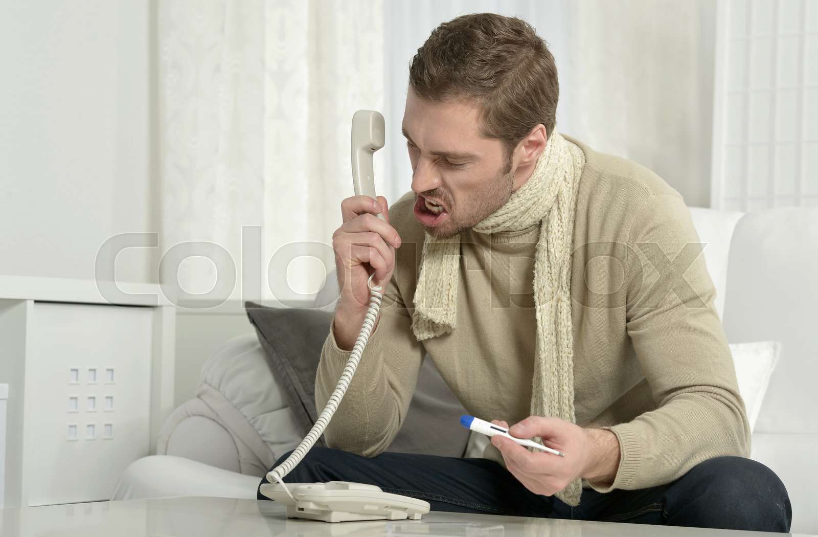 sick man calling his doctor | Stock image | Colourbox