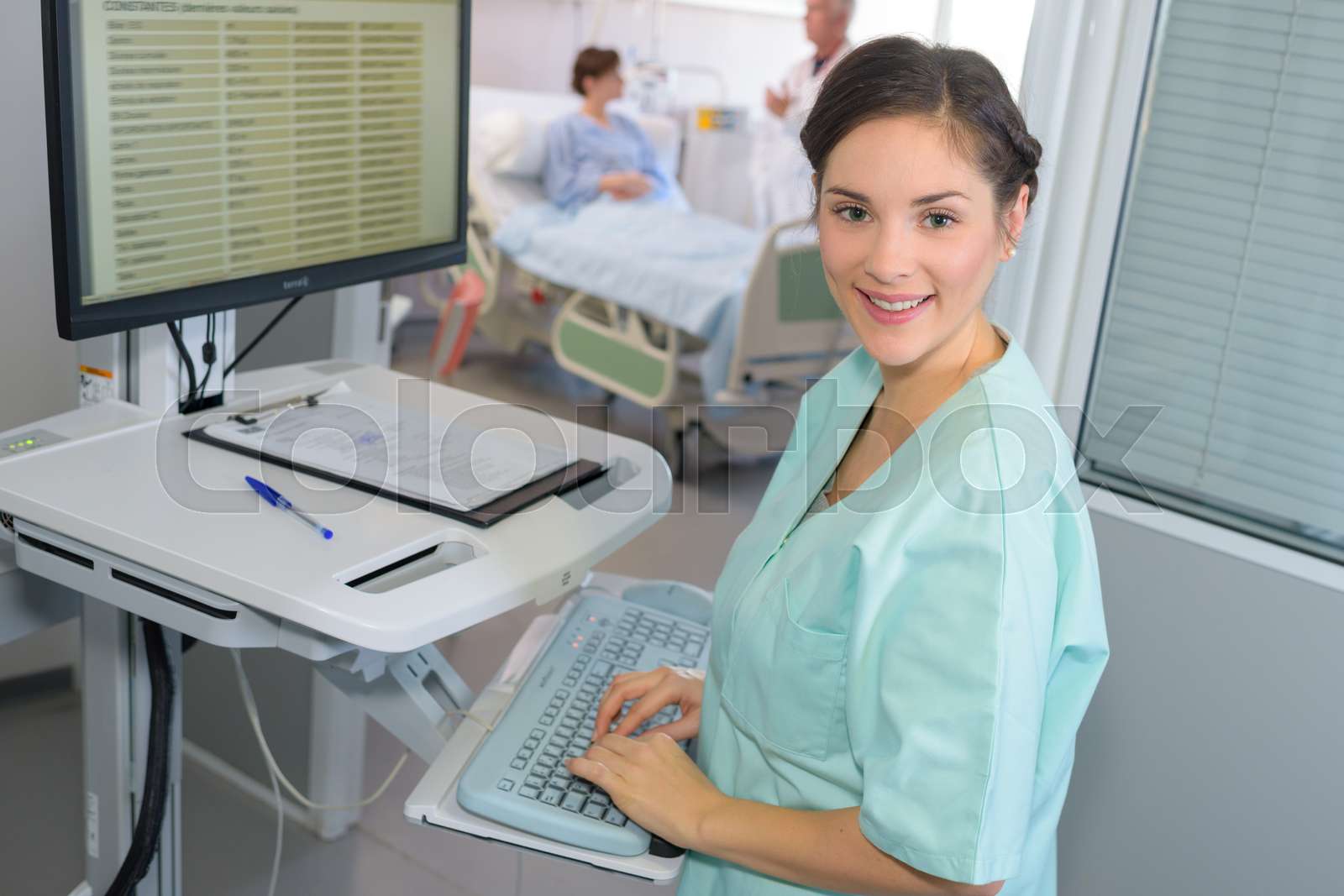 Nurse using computer | Stock image | Colourbox