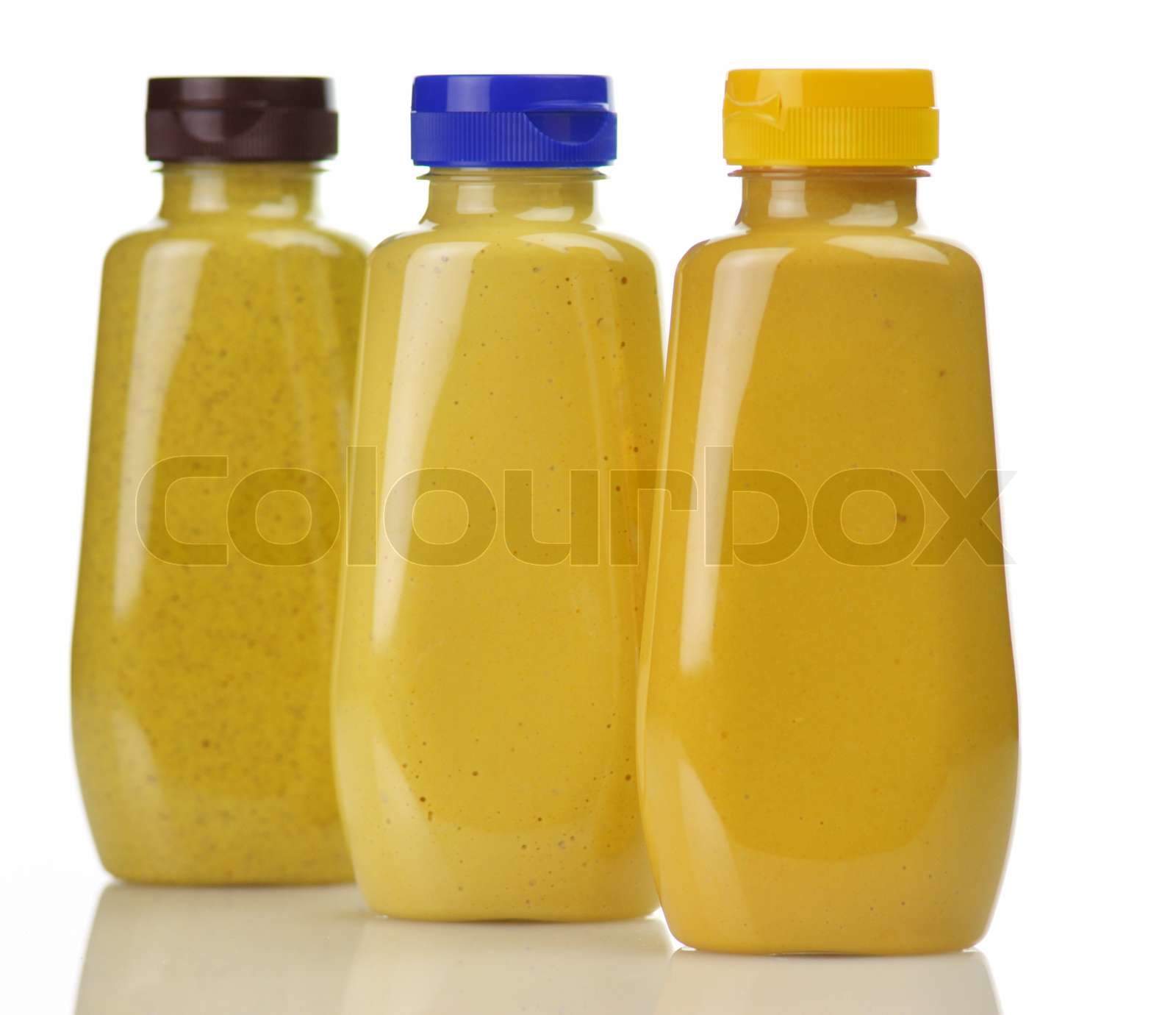 plastic bottles of honey ,dijon and spicy brown mustard | Stock image ...