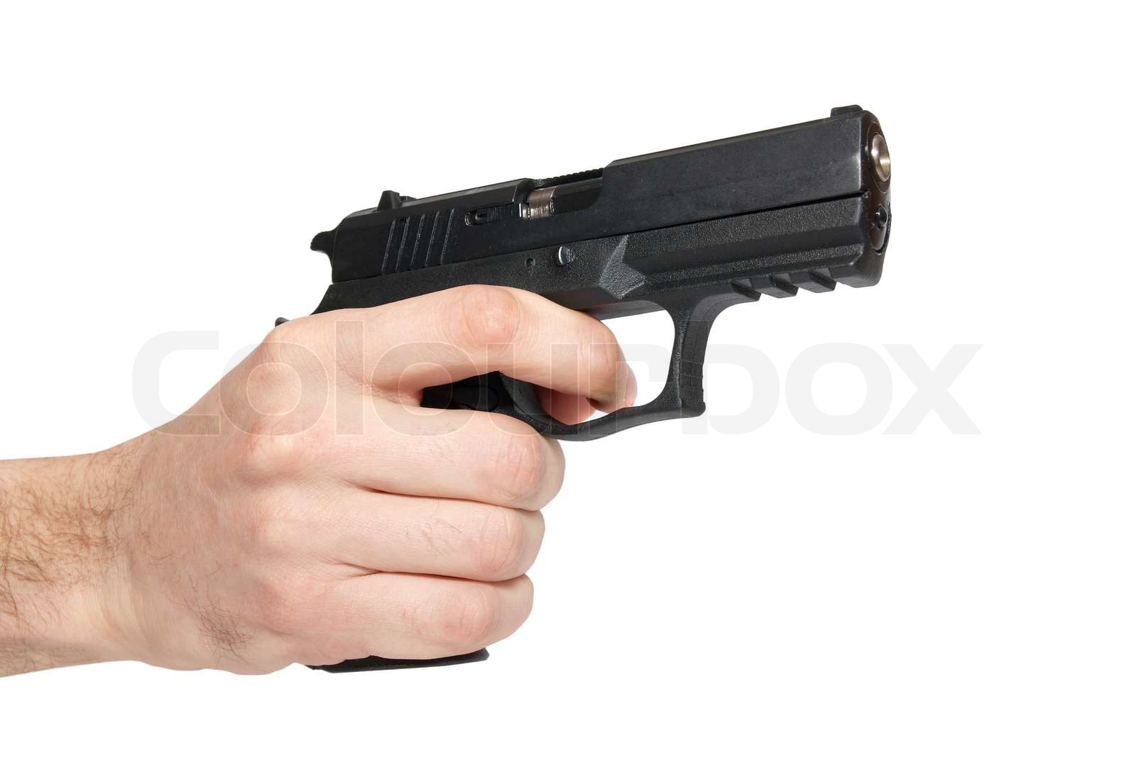 Black gun in a hand isolated on white | Stock image | Colourbox
