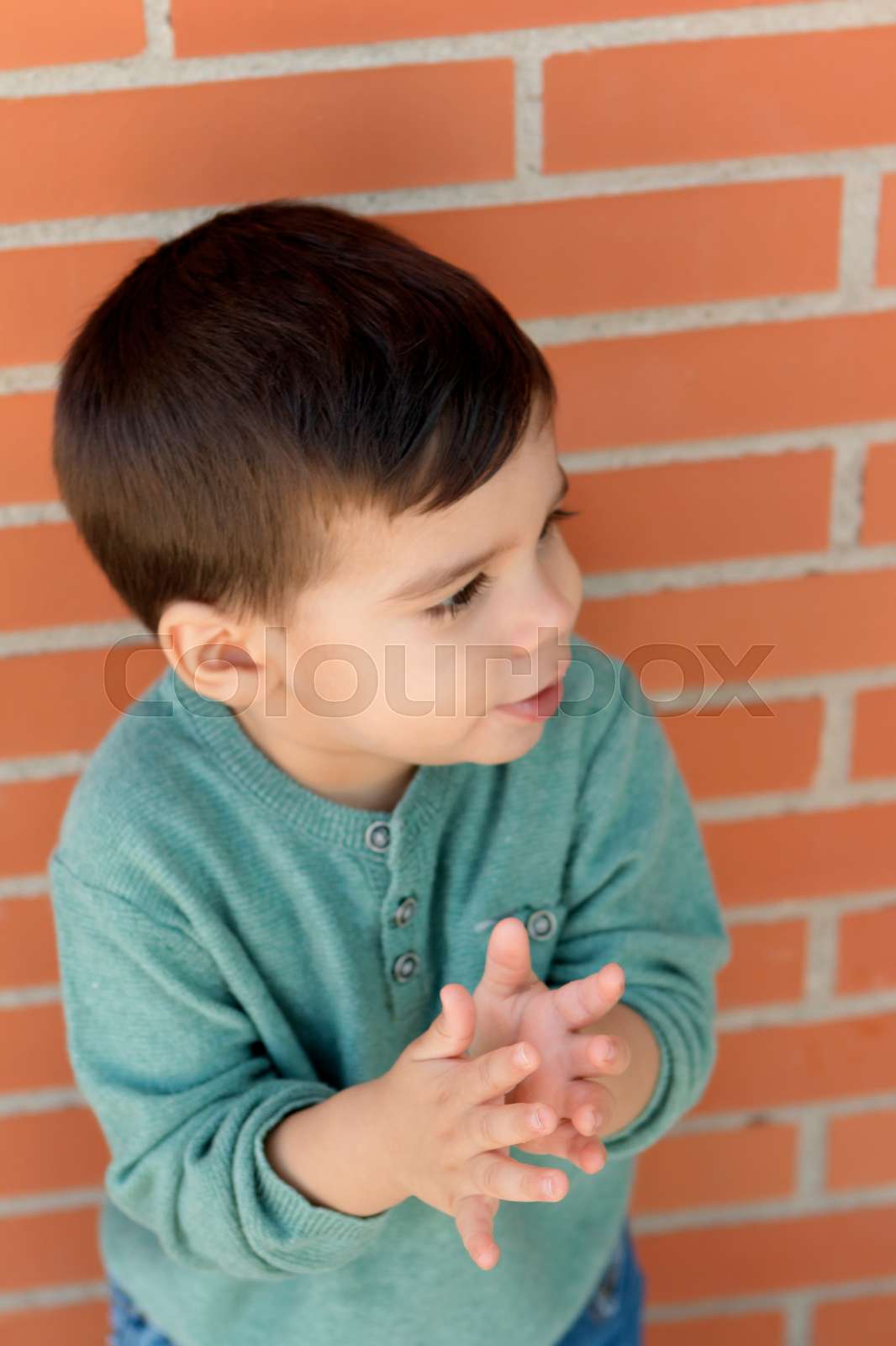 Cheerful child playing palms | Stock image | Colourbox