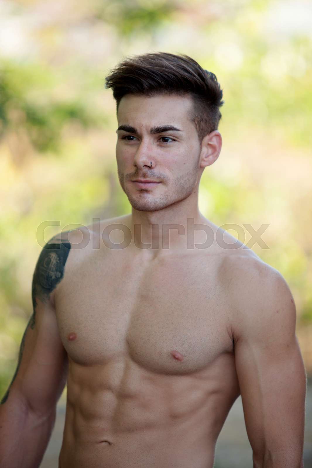 Young boy with showing his muscles. | Stock image | Colourbox