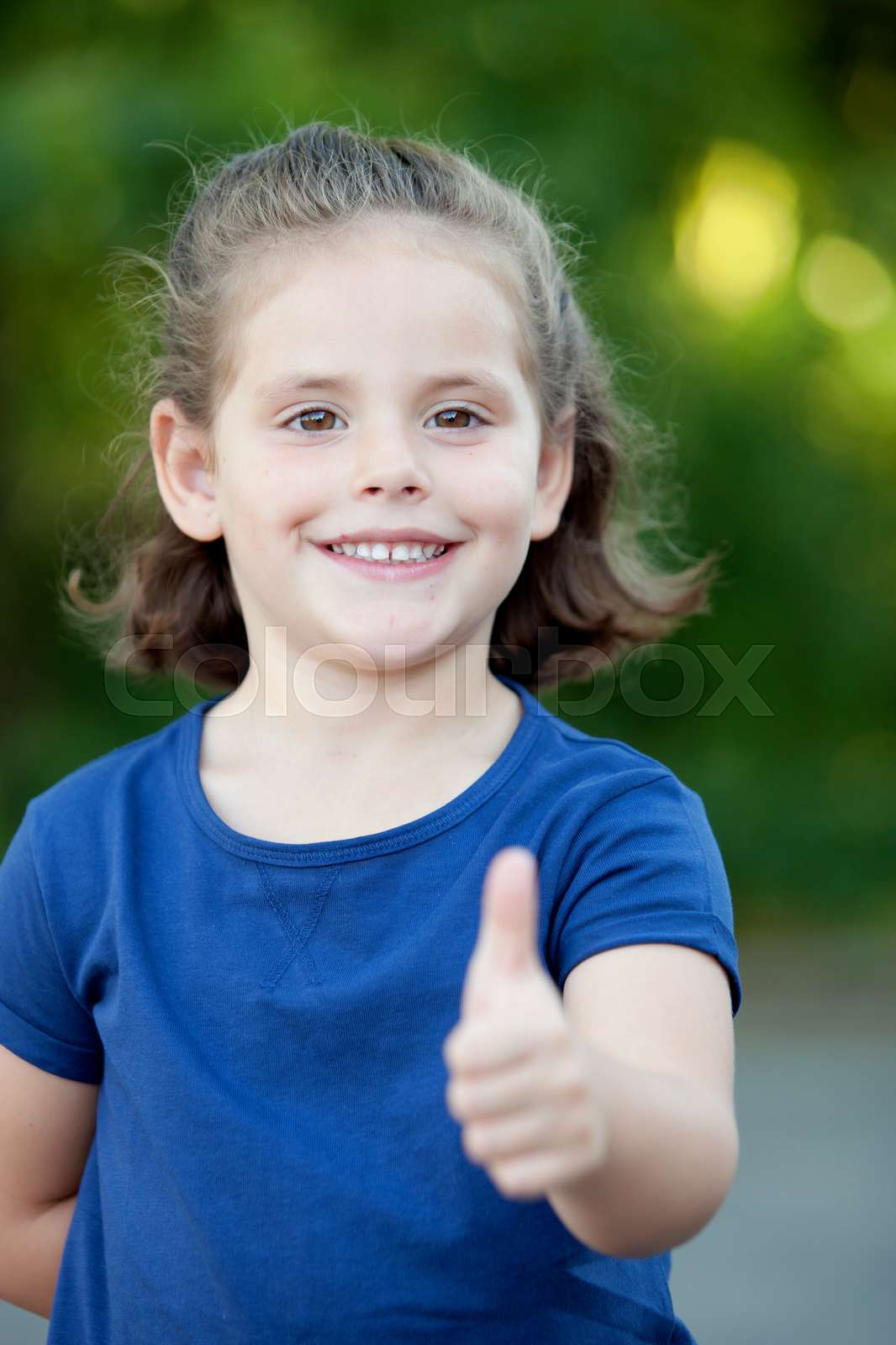Cute little girl saying Ok | Stock image | Colourbox