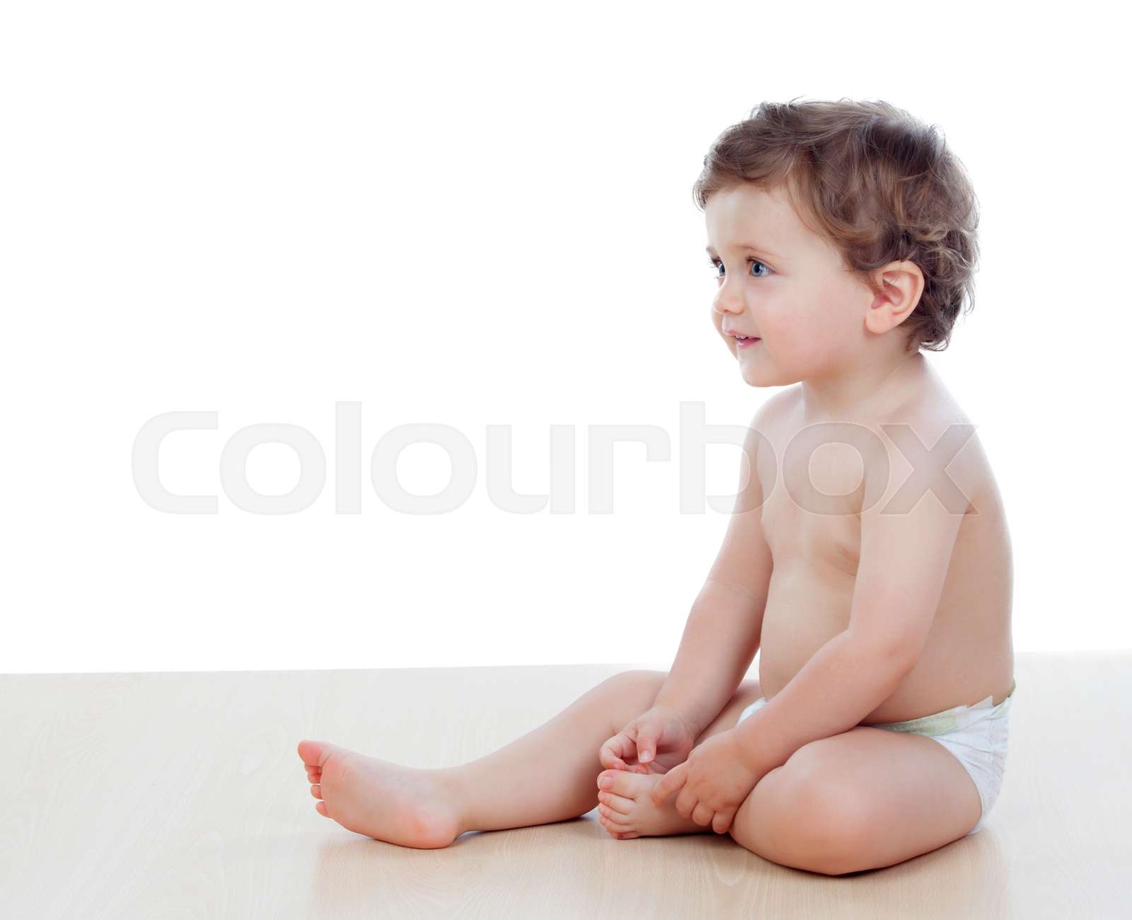 Baby with one years old doing funny gestures | Stock image | Colourbox