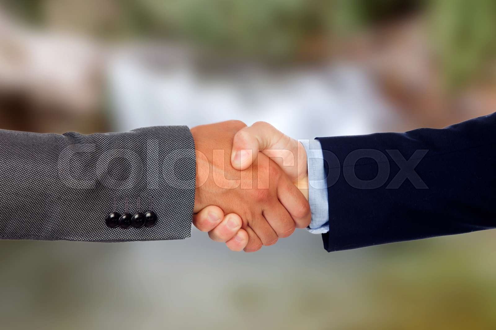 Handshake between businessmen | Stock image | Colourbox