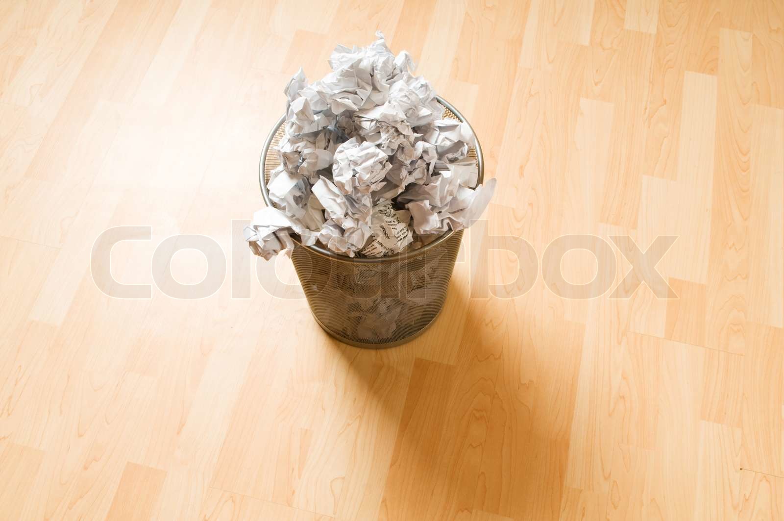 Garbage bin with paper waste isolated on white | Stock image | Colourbox