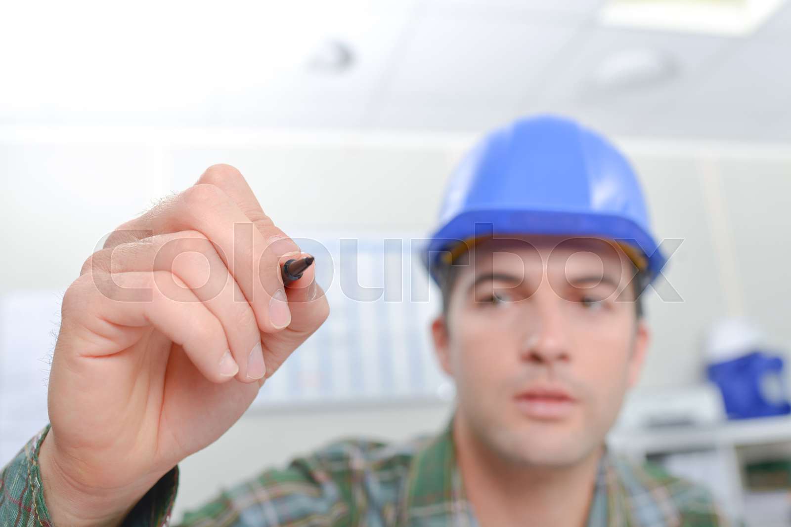 Going over plans together | Stock image | Colourbox