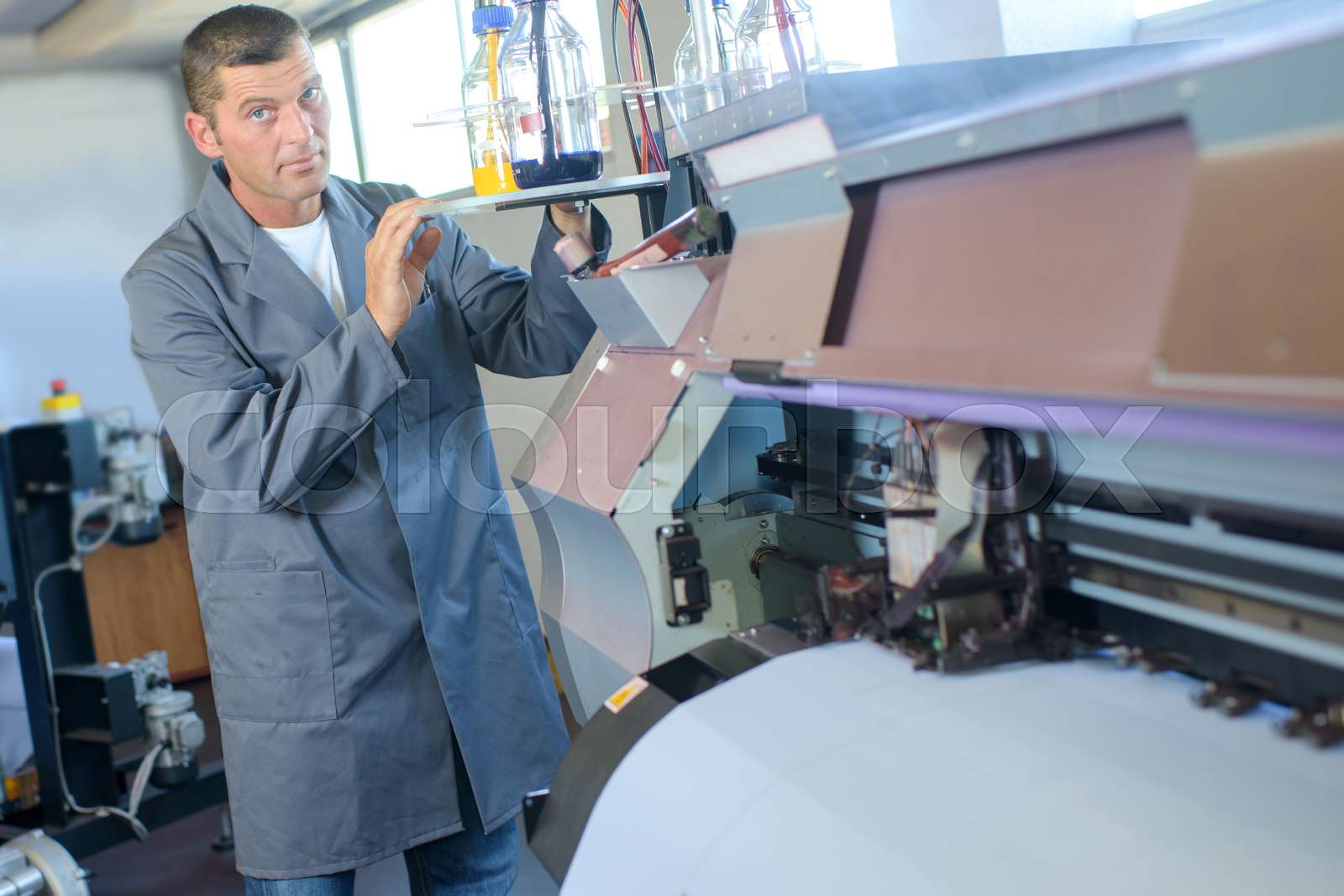 Man using printing machine | Stock image | Colourbox
