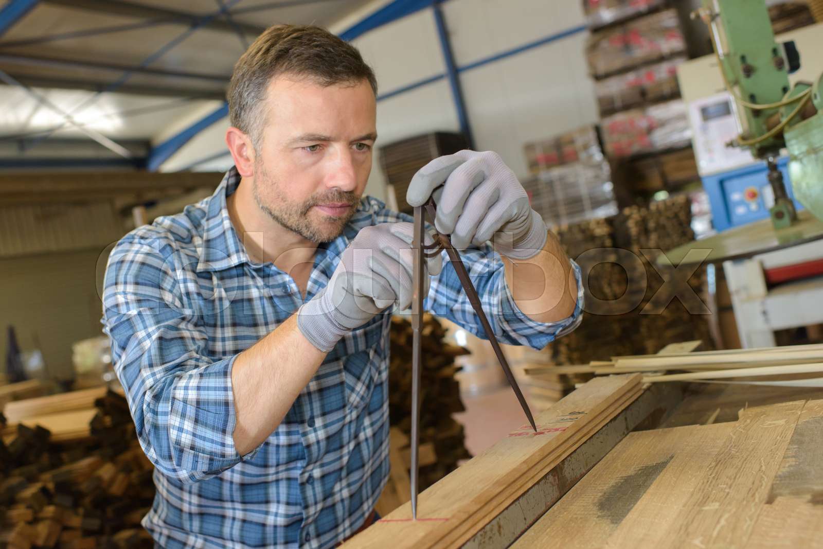sawmill employee working with wood tools and machinery | Stock image ...