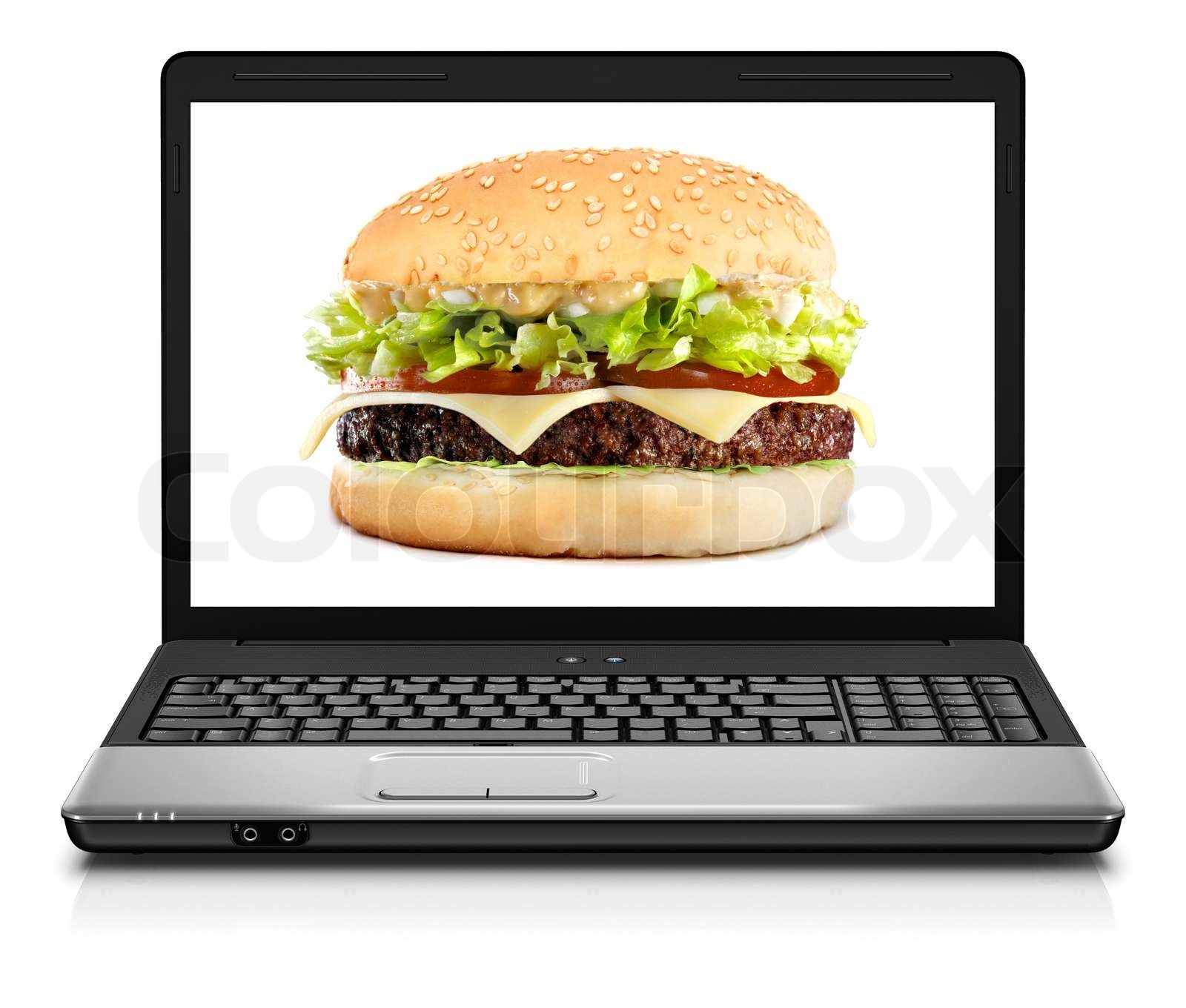 Laptop computer close-up with hamburger | Stock image | Colourbox