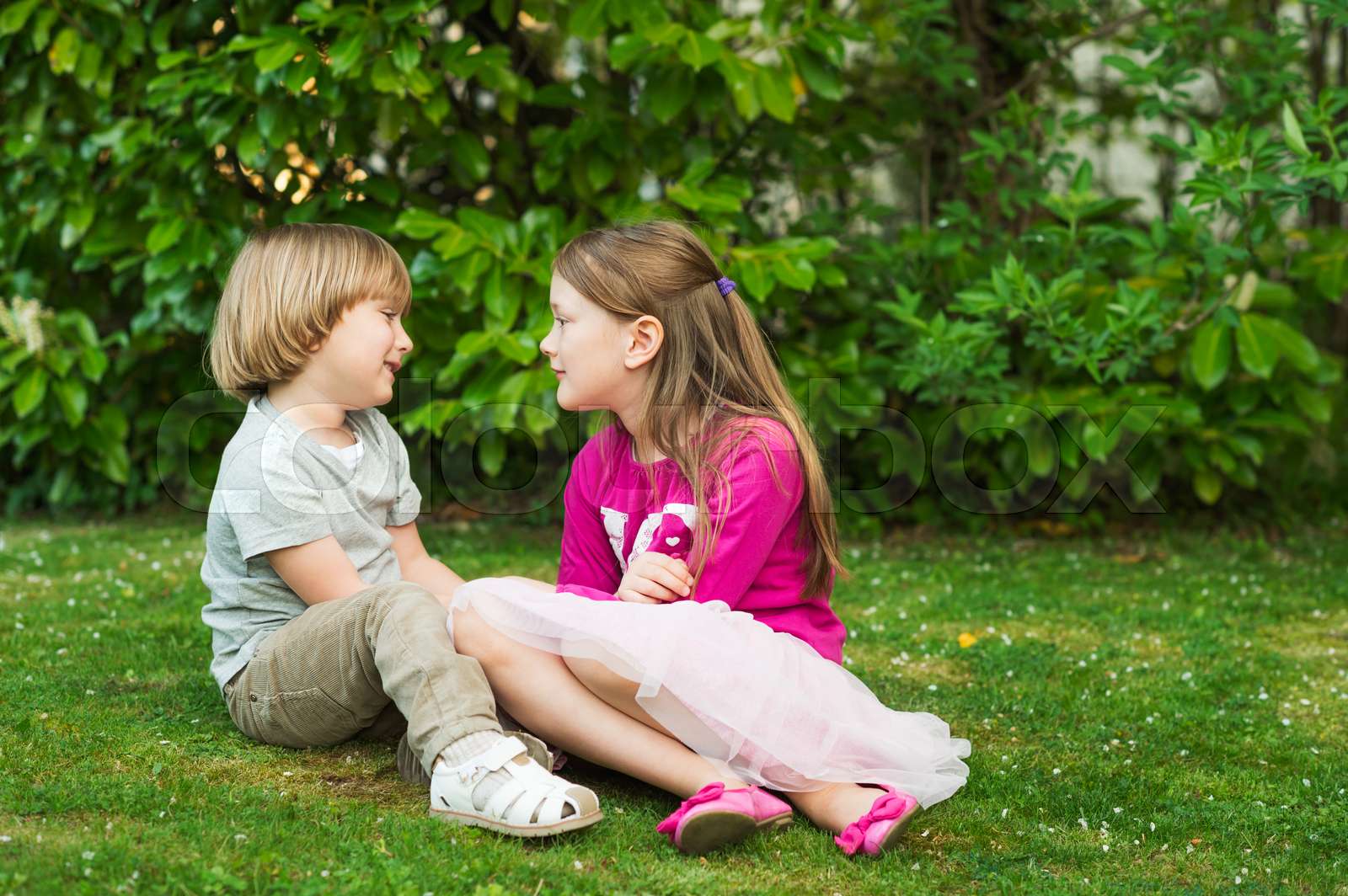Adorable kids playing together outdoors | Stock image | Colourbox
