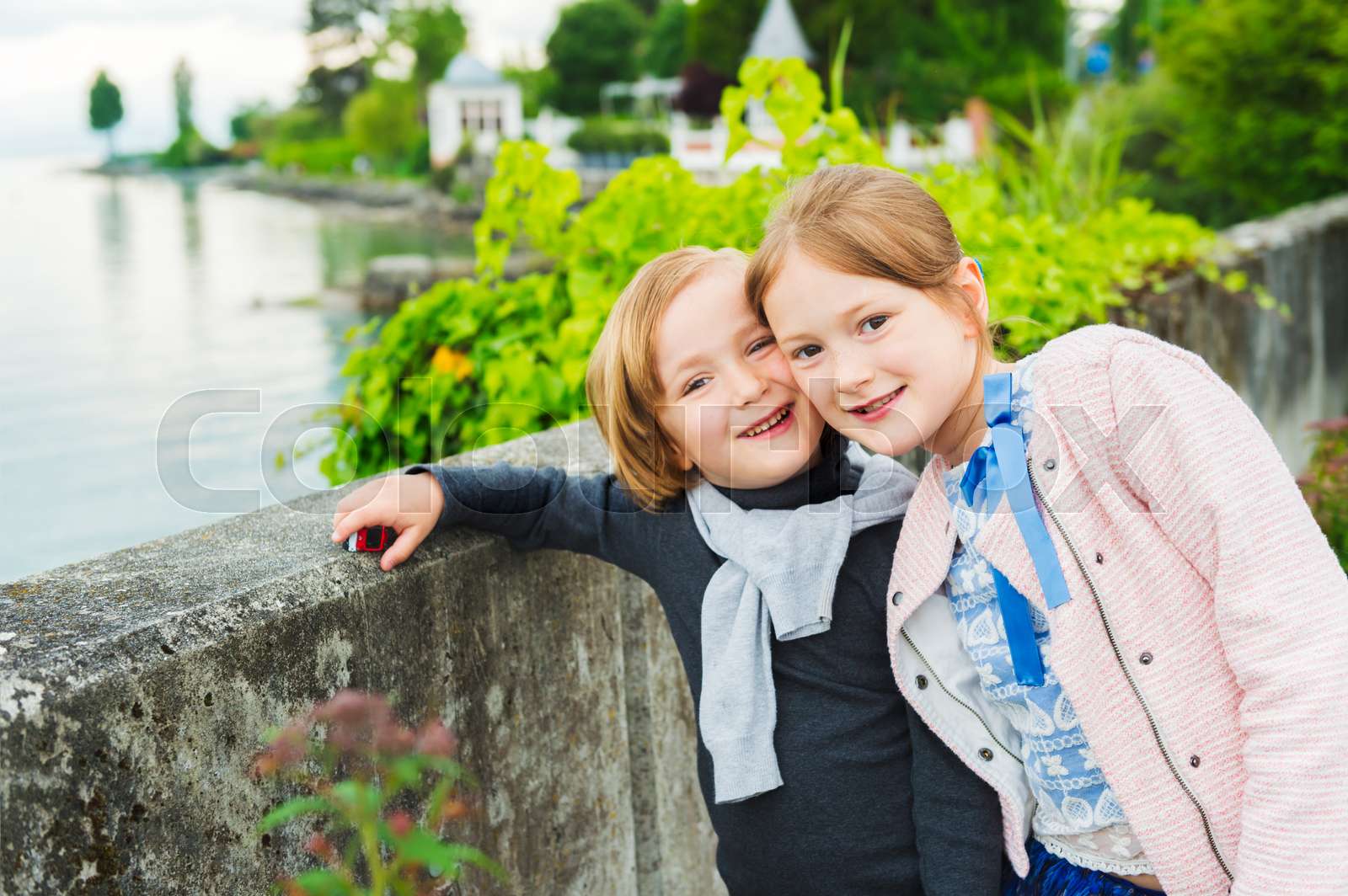 Two cute kids playing outdoors | Stock image | Colourbox