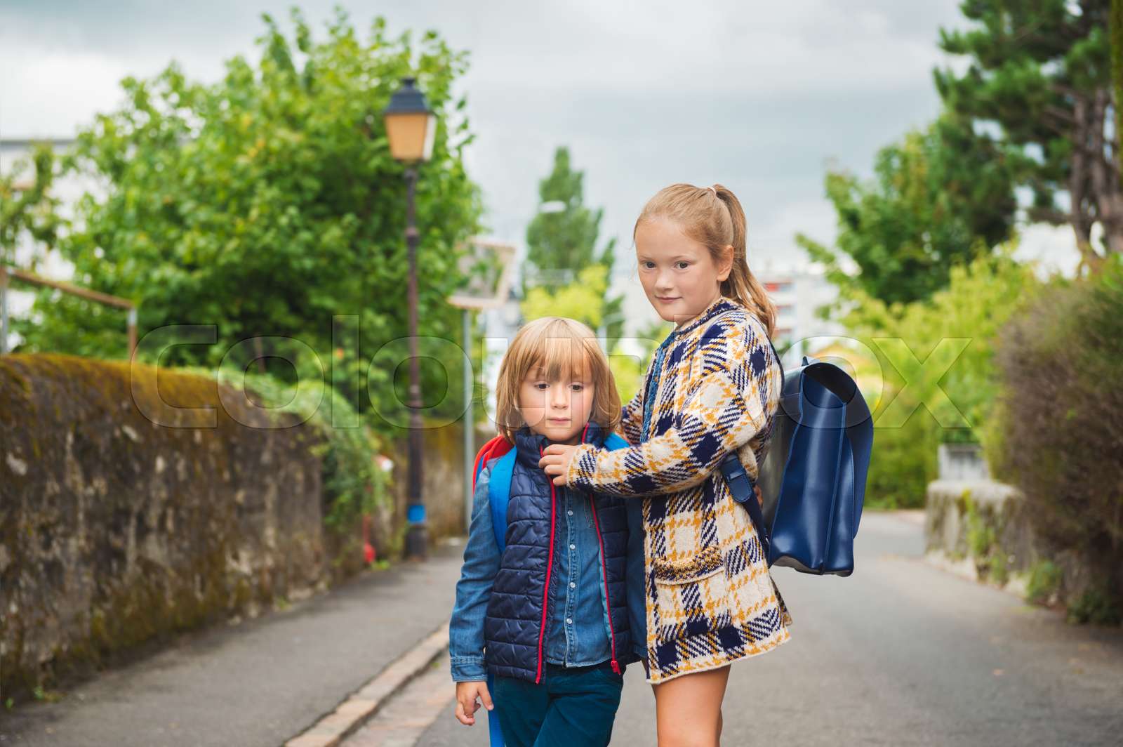Cute kids with backpacks walking to school | Stock image | Colourbox