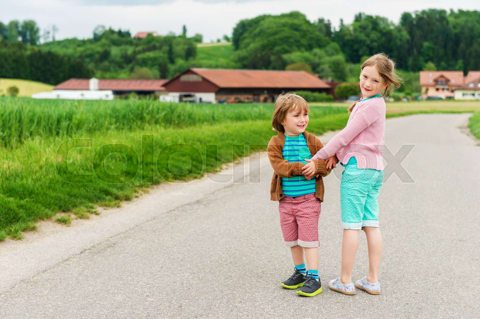 Two cute kids playing in a countryside | Stock image | Colourbox