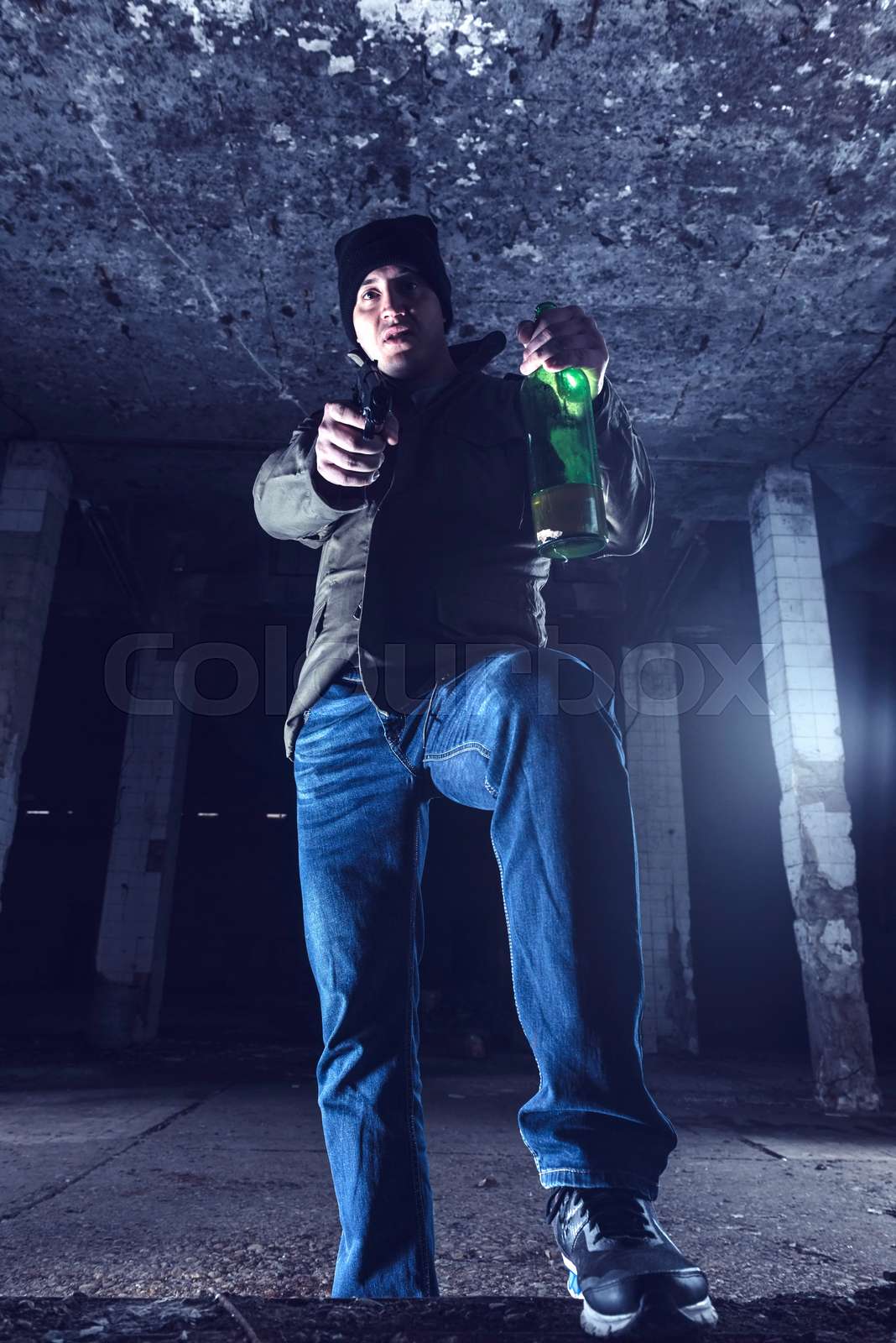 Robber with gun | Stock image | Colourbox