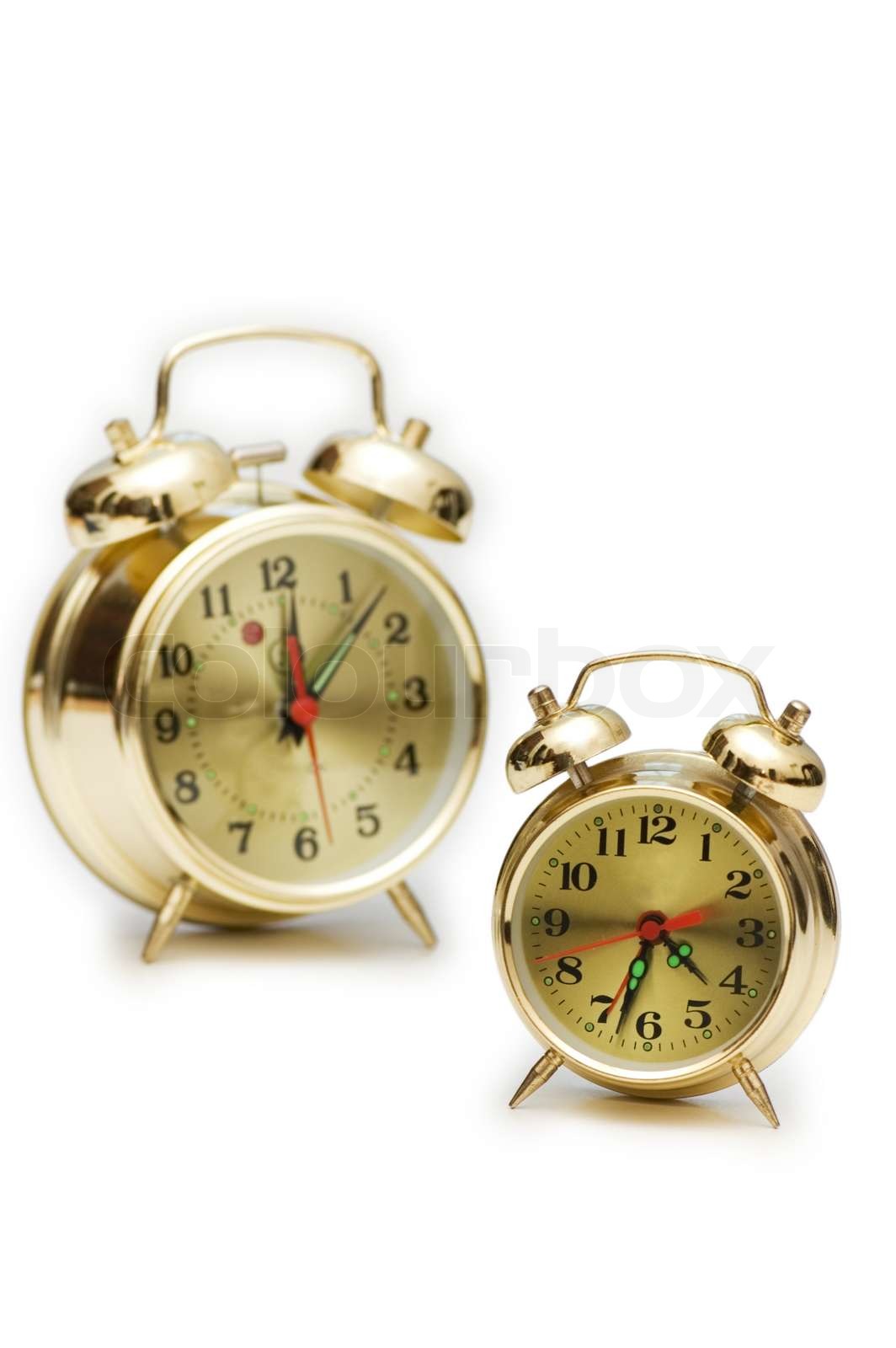 Golden alarm clocks isolated on the white | Stock image | Colourbox