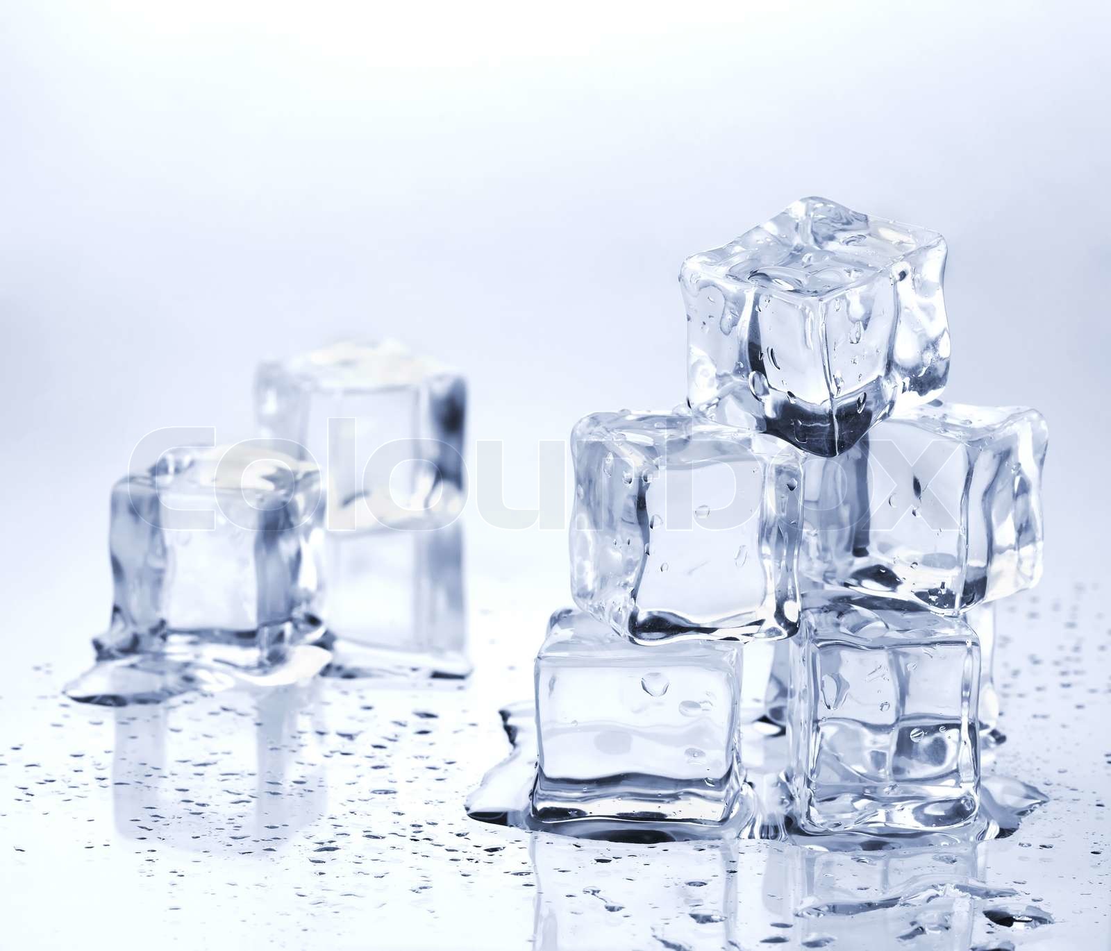 Ice Cubes Melting In Glass