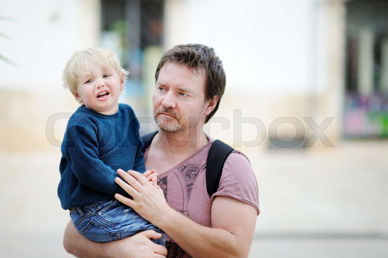 Middle age father with his crying little son outdoors | Stock image ...