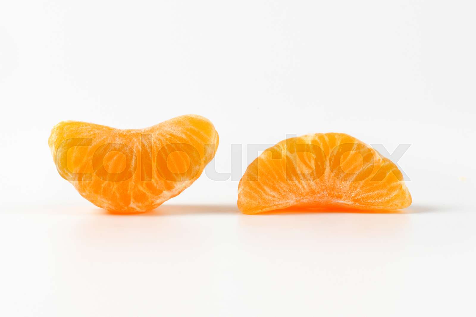 Peeled mandarin segments | Stock image | Colourbox