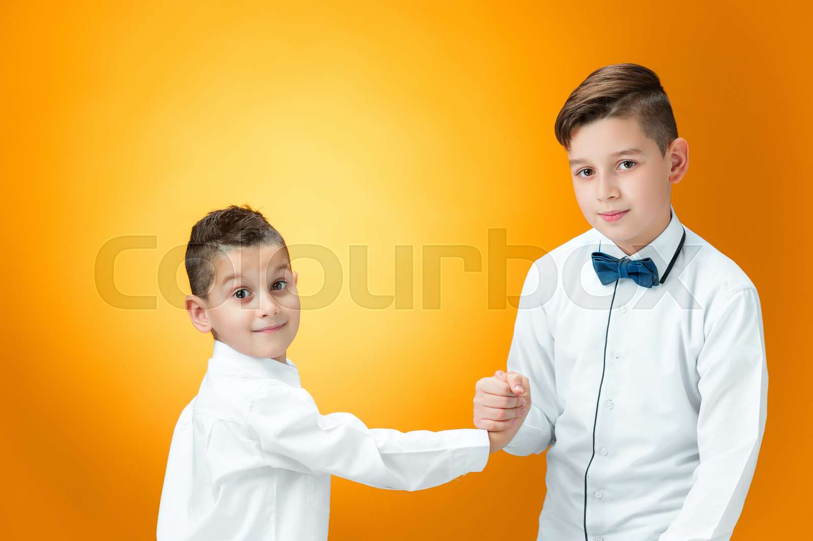 Happy children playfully fighting | Stock image | Colourbox