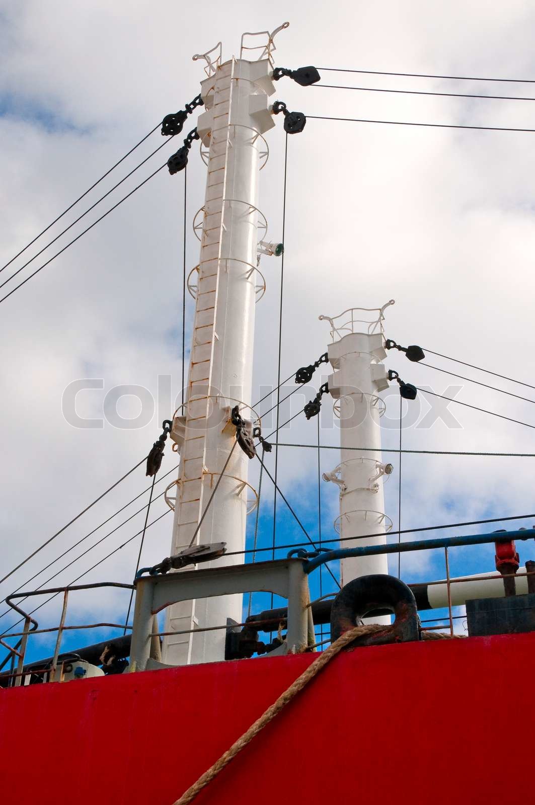 Masts of a red old freighter with pulleys | Stock image | Colourbox