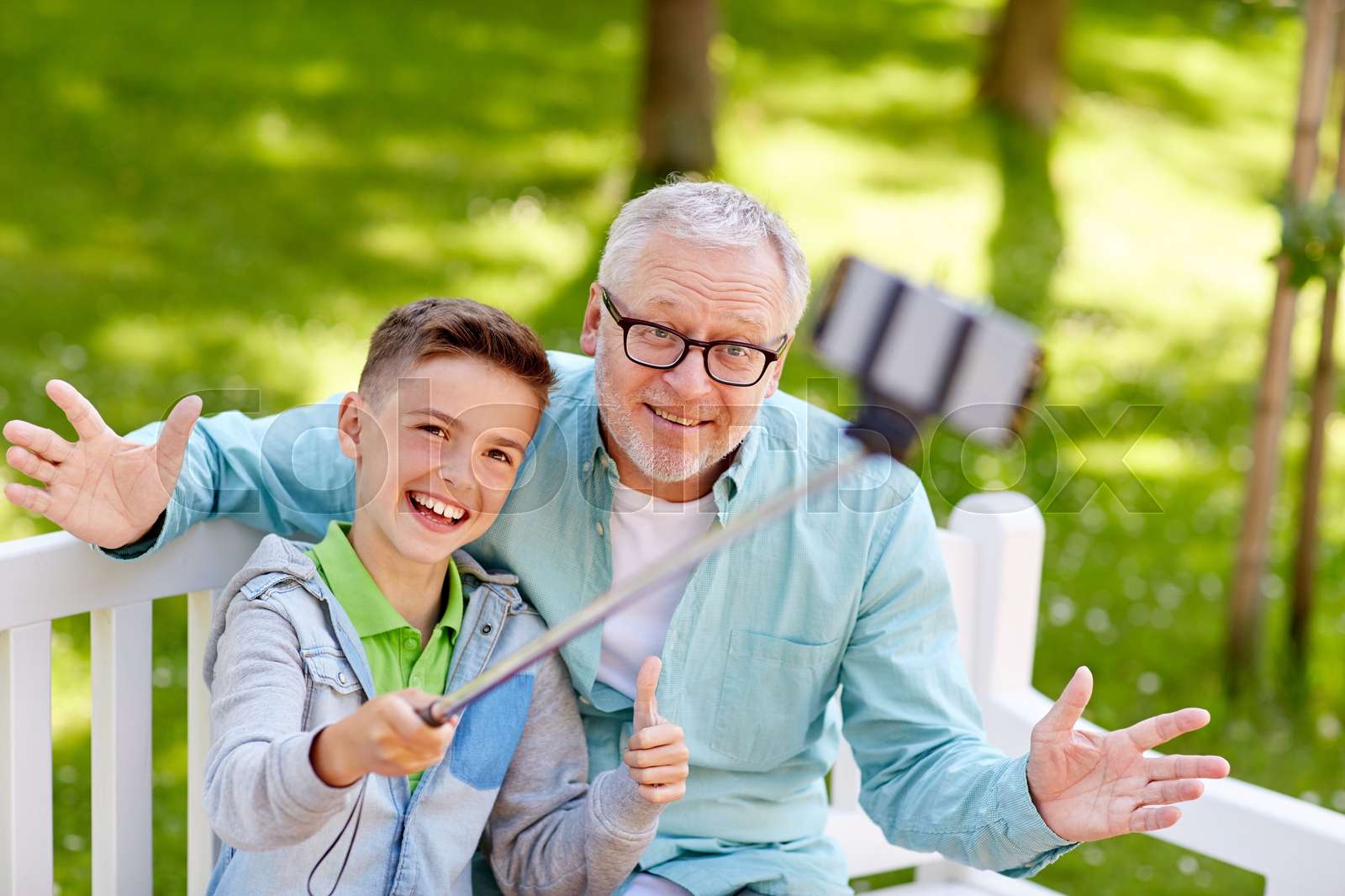 old man and boy taking selfie by smartphone | Stock image | Colourbox