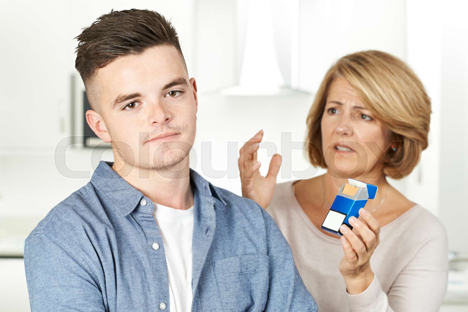 Mother Talking To Teenage Son About Dangers Of Smoking Stock Image