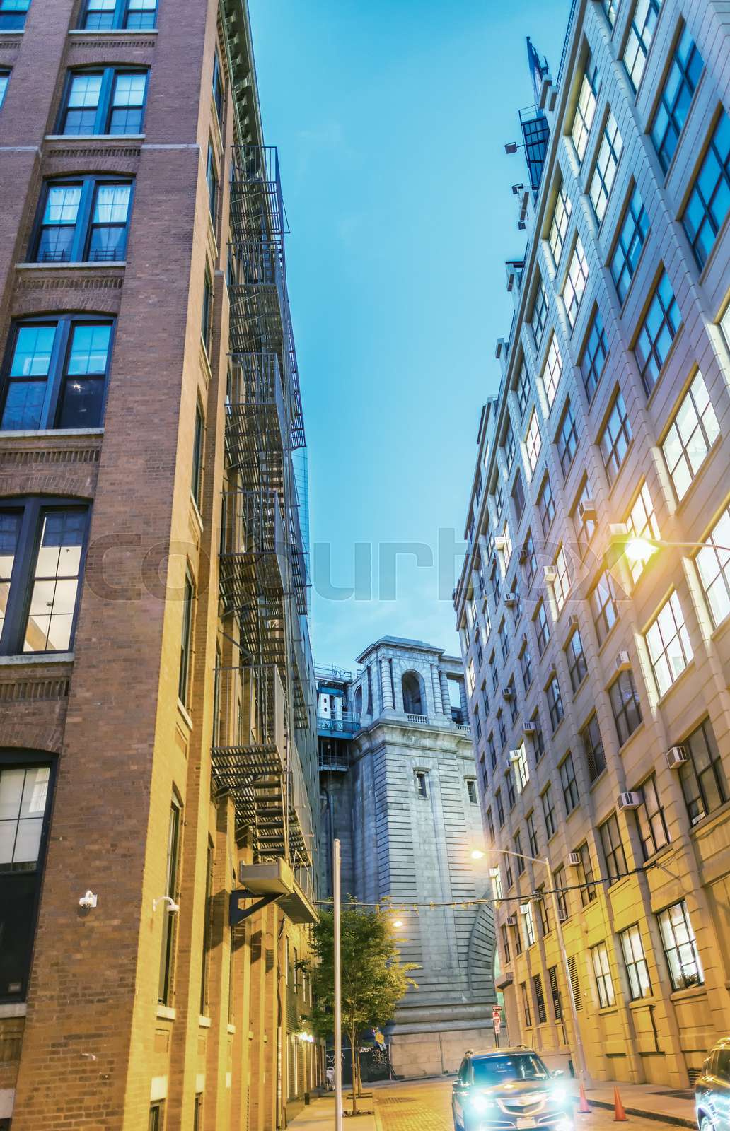 Brooklyn buildings and city bridge tower at sunset | Stock image ...