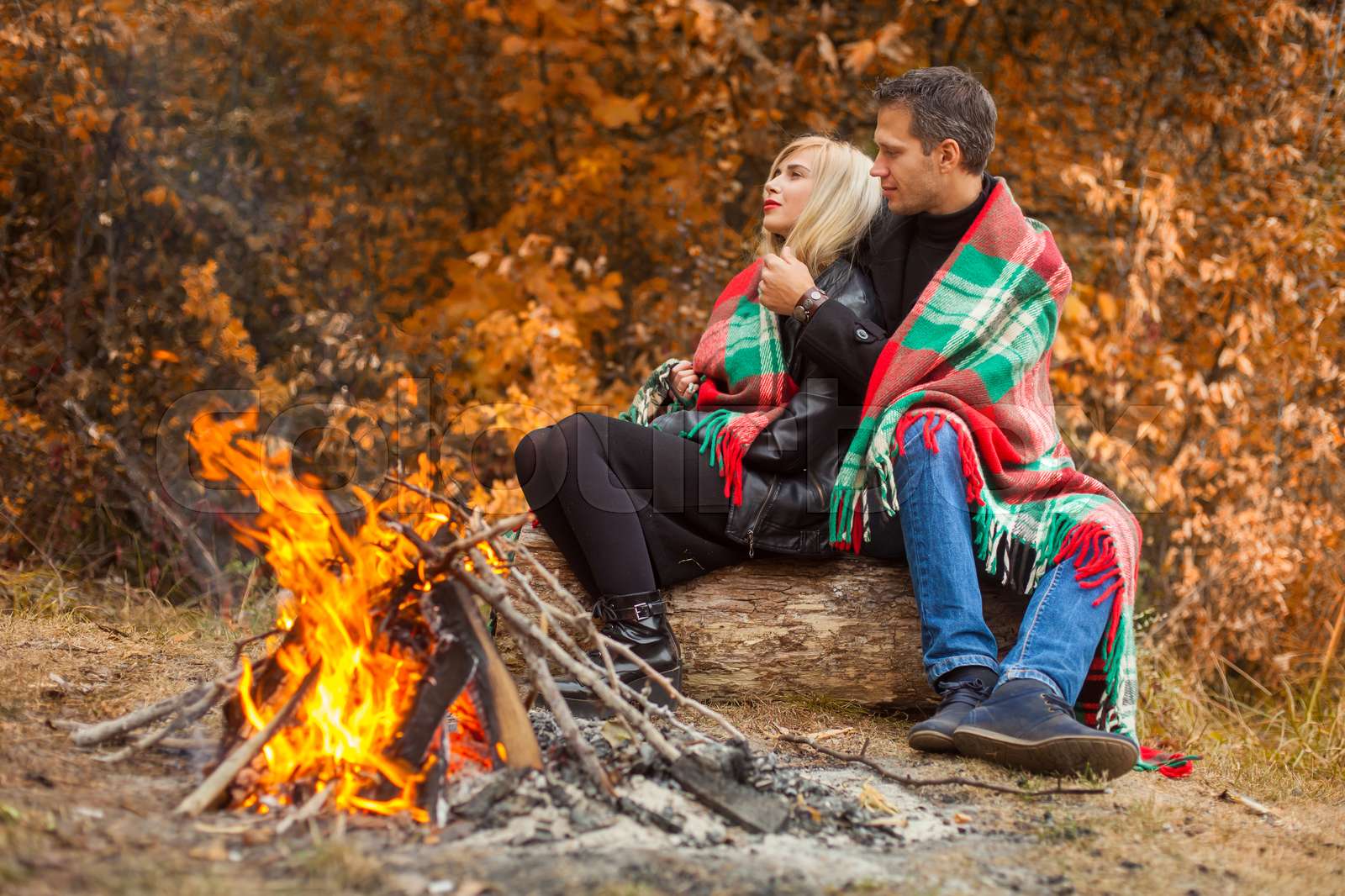Hugs in front of fire | Stock image | Colourbox