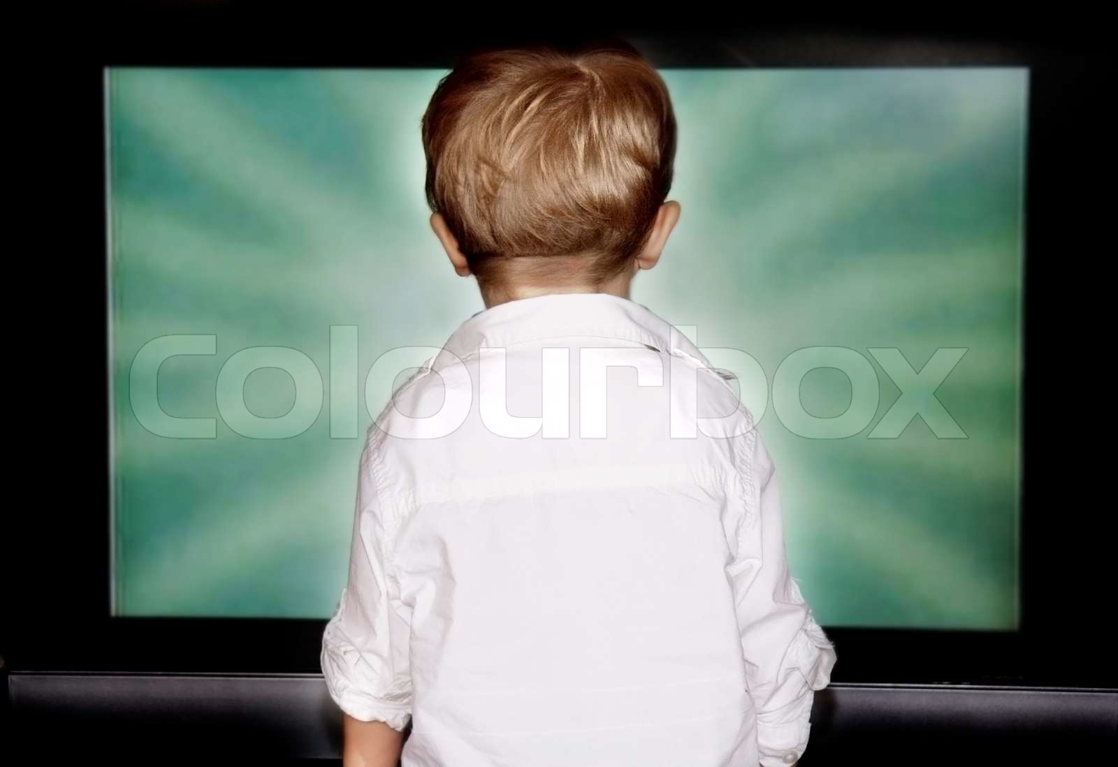 young boy staring at tv screen | Stock image | Colourbox