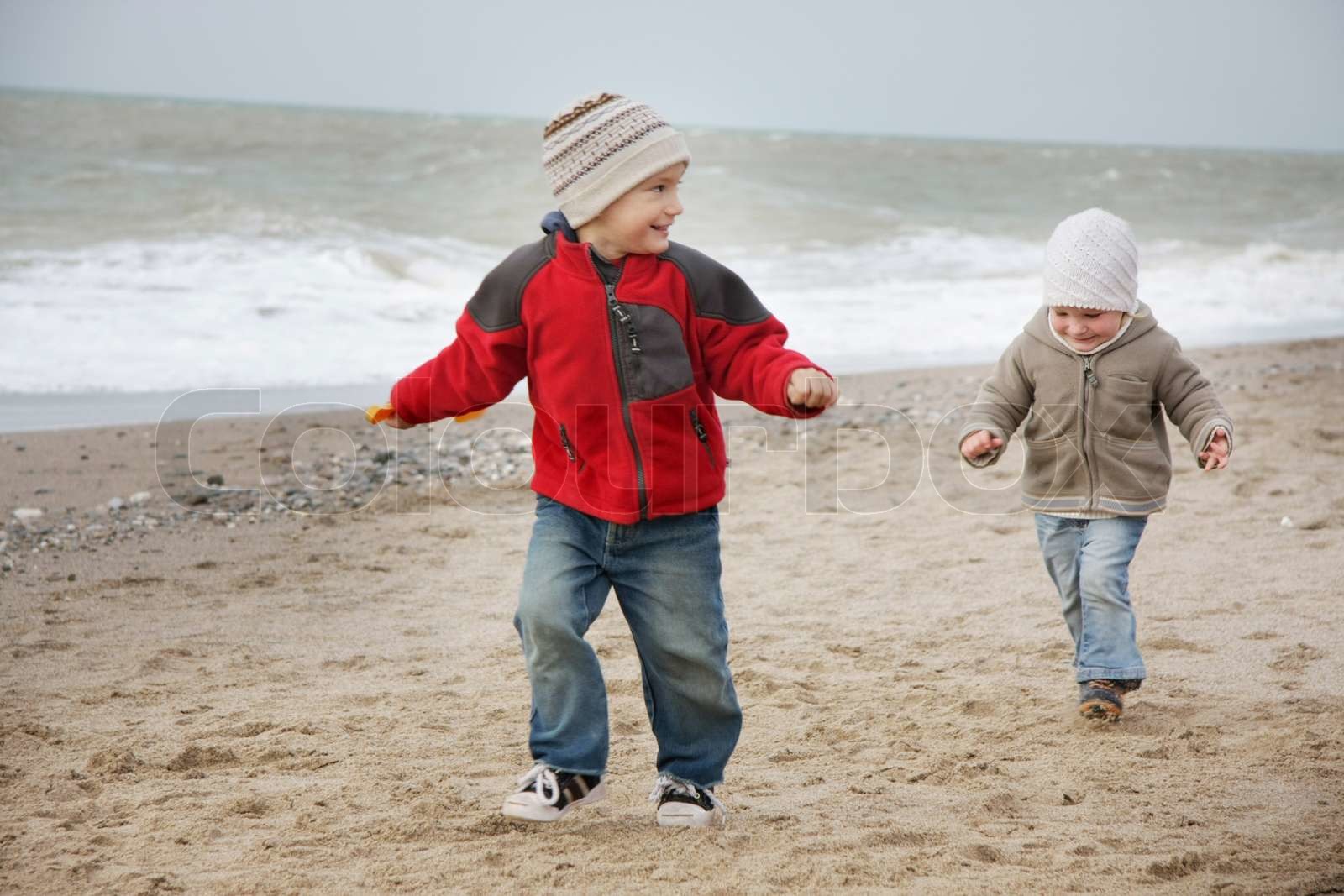 two children running on beach | Stock image | Colourbox