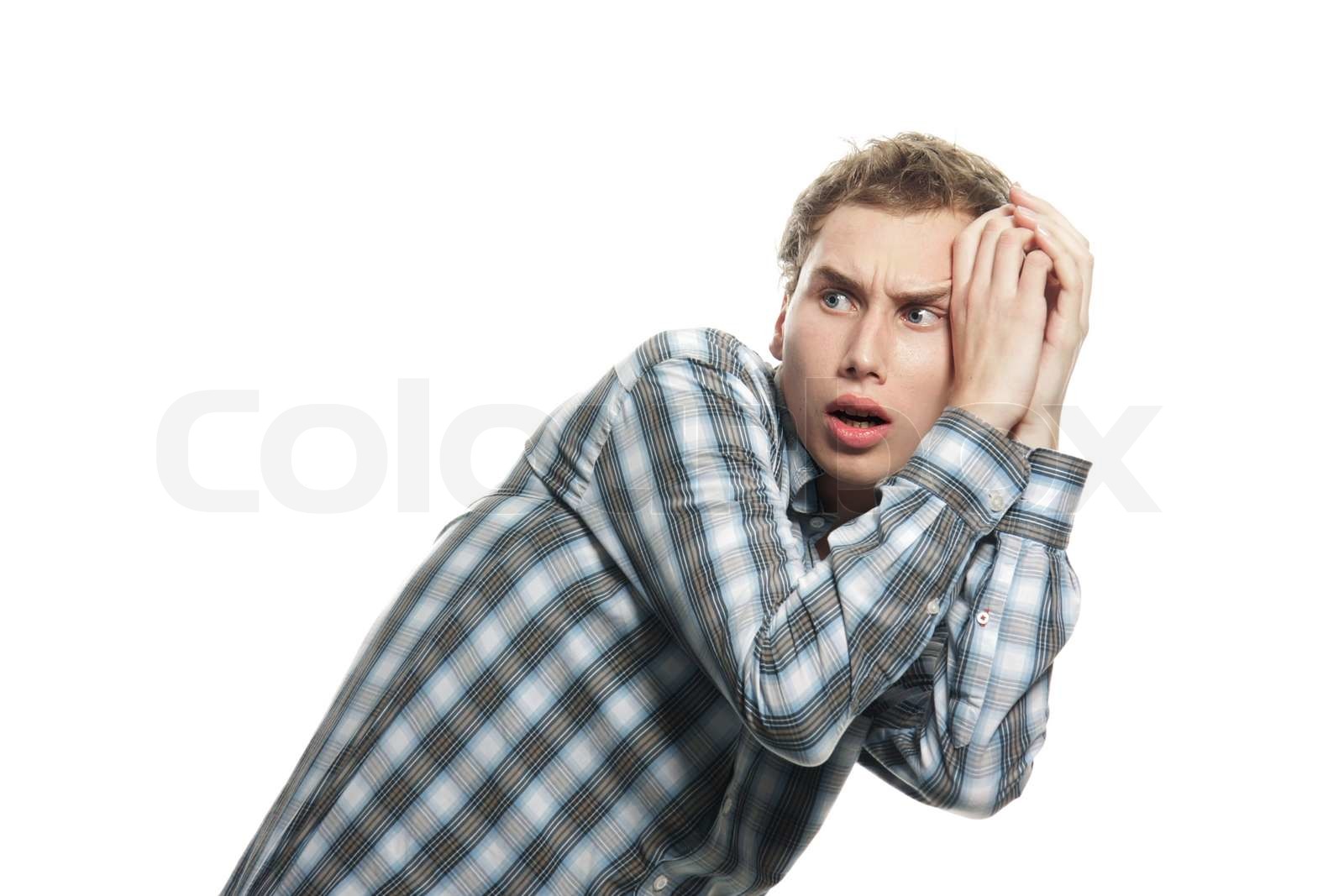 scared young man isolated over white | Stock image | Colourbox
