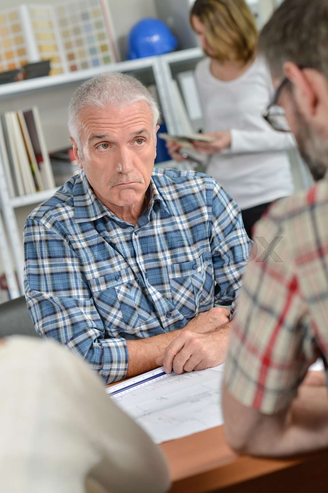 Man in meeting with couple, bemused facial expression | Stock image ...