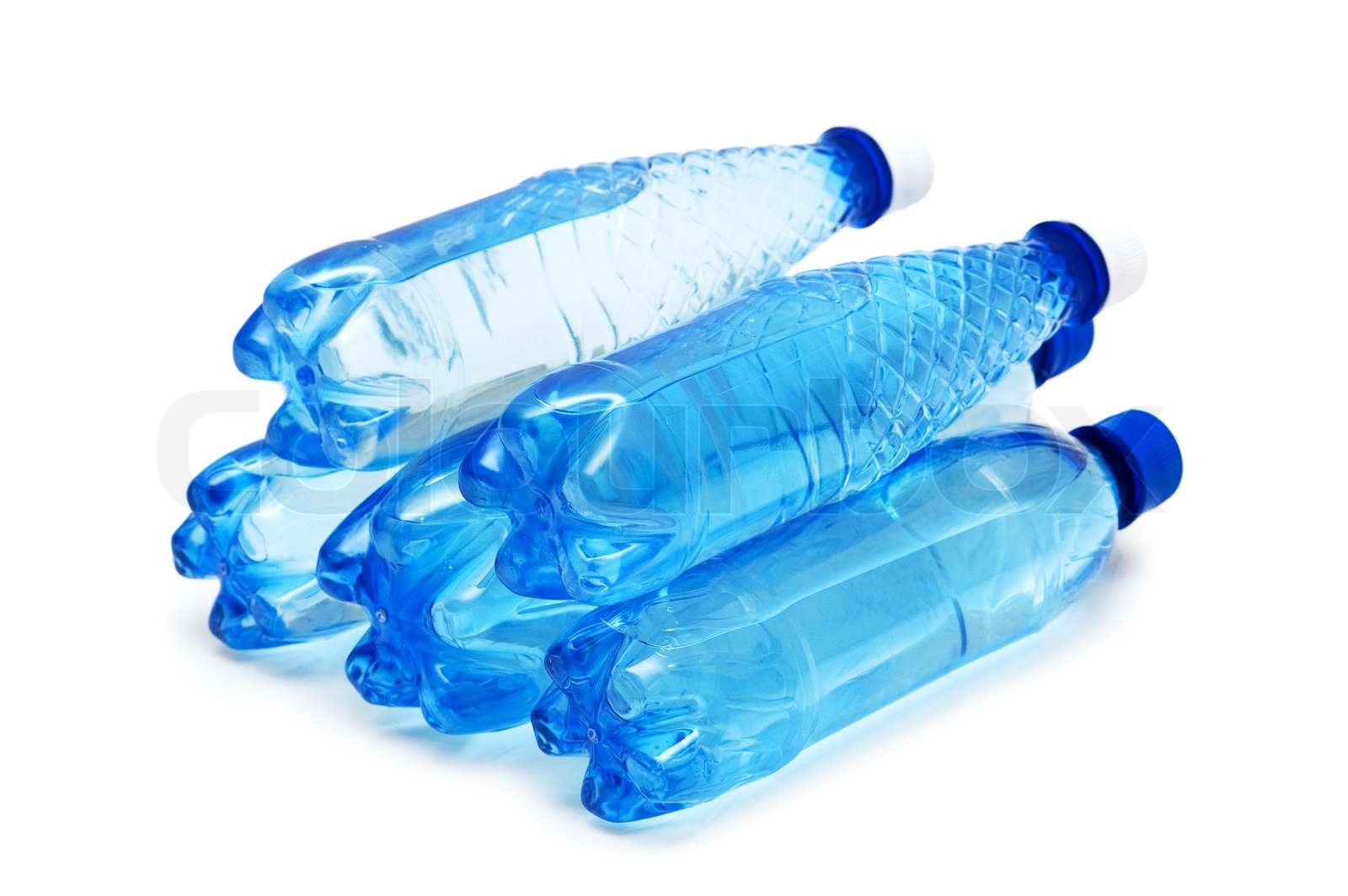 Stack of water bottles isolated on white | Stock image | Colourbox