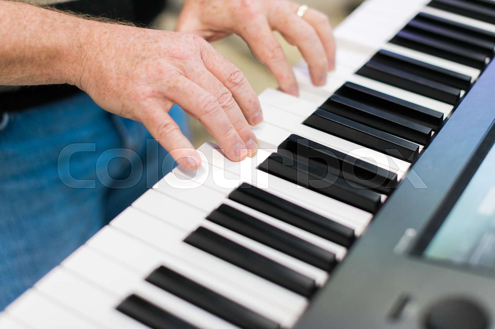 Keyboard player performing on stage | Stock image | Colourbox
