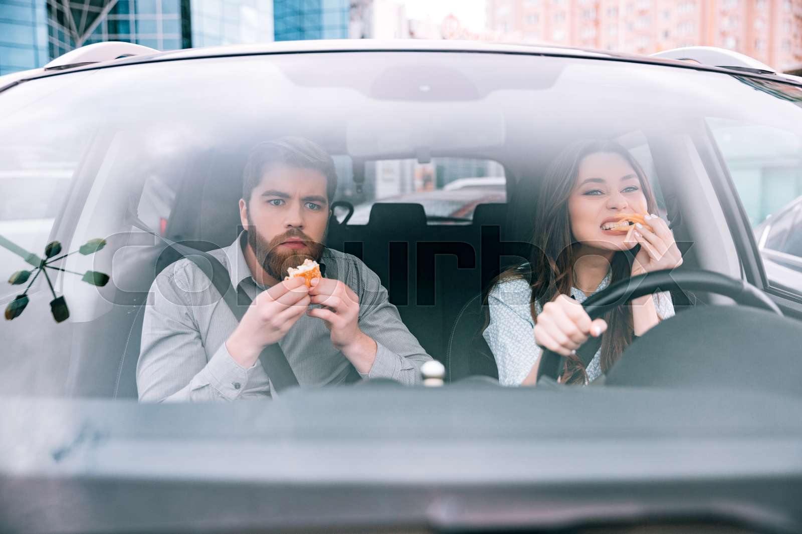 Couple with eat in car | Stock image | Colourbox