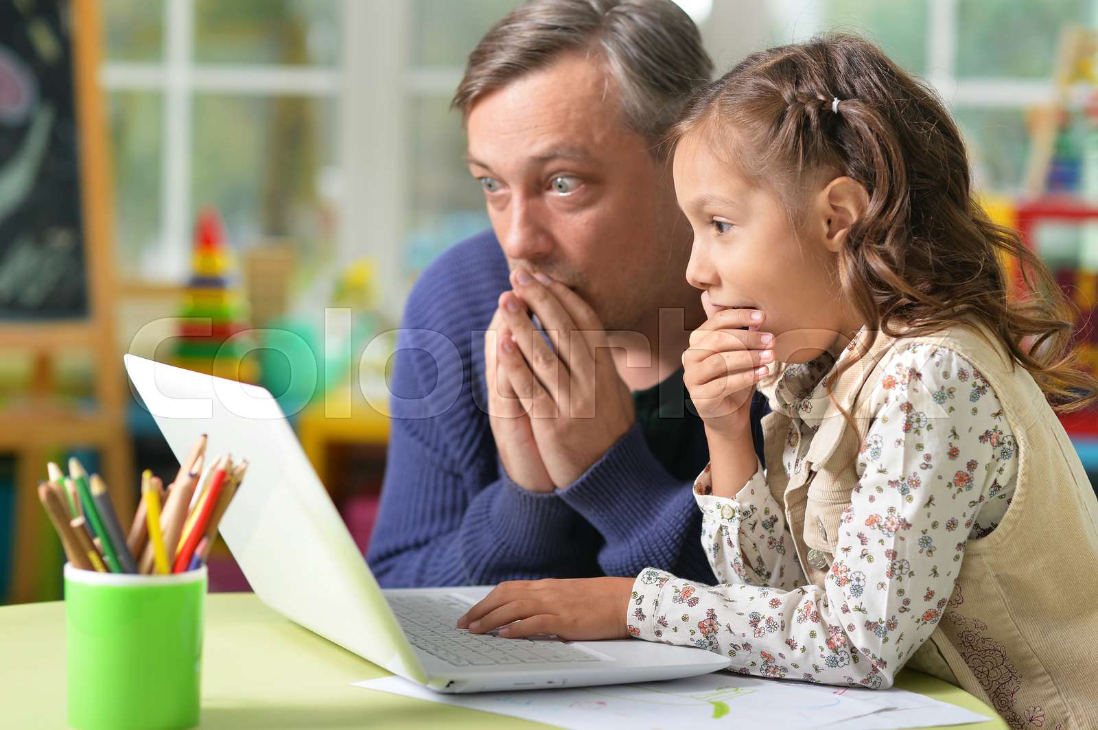 father and daughter with laptop | Stock image | Colourbox